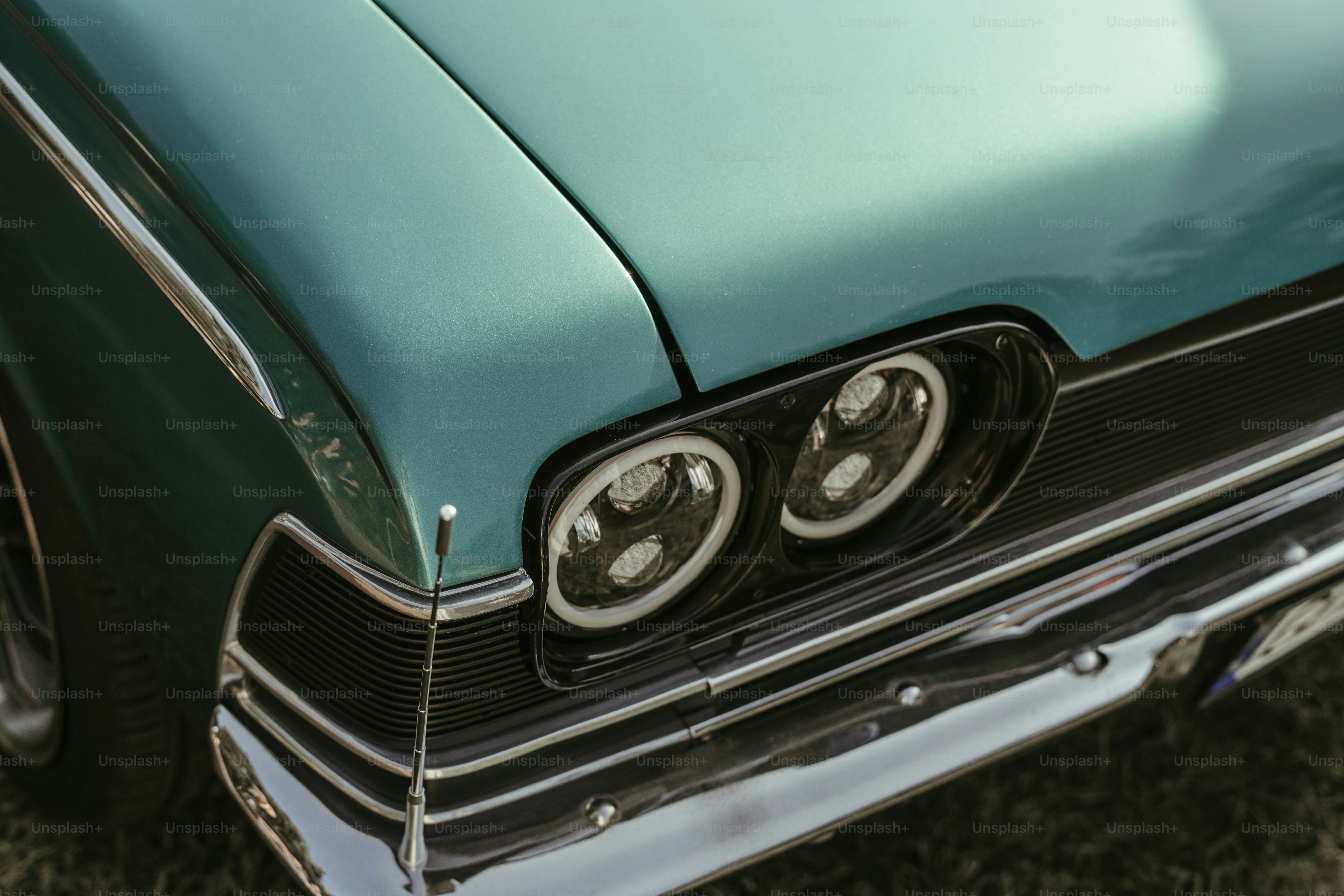 A close up of the front of a green car photo – Car Image on Unsplash