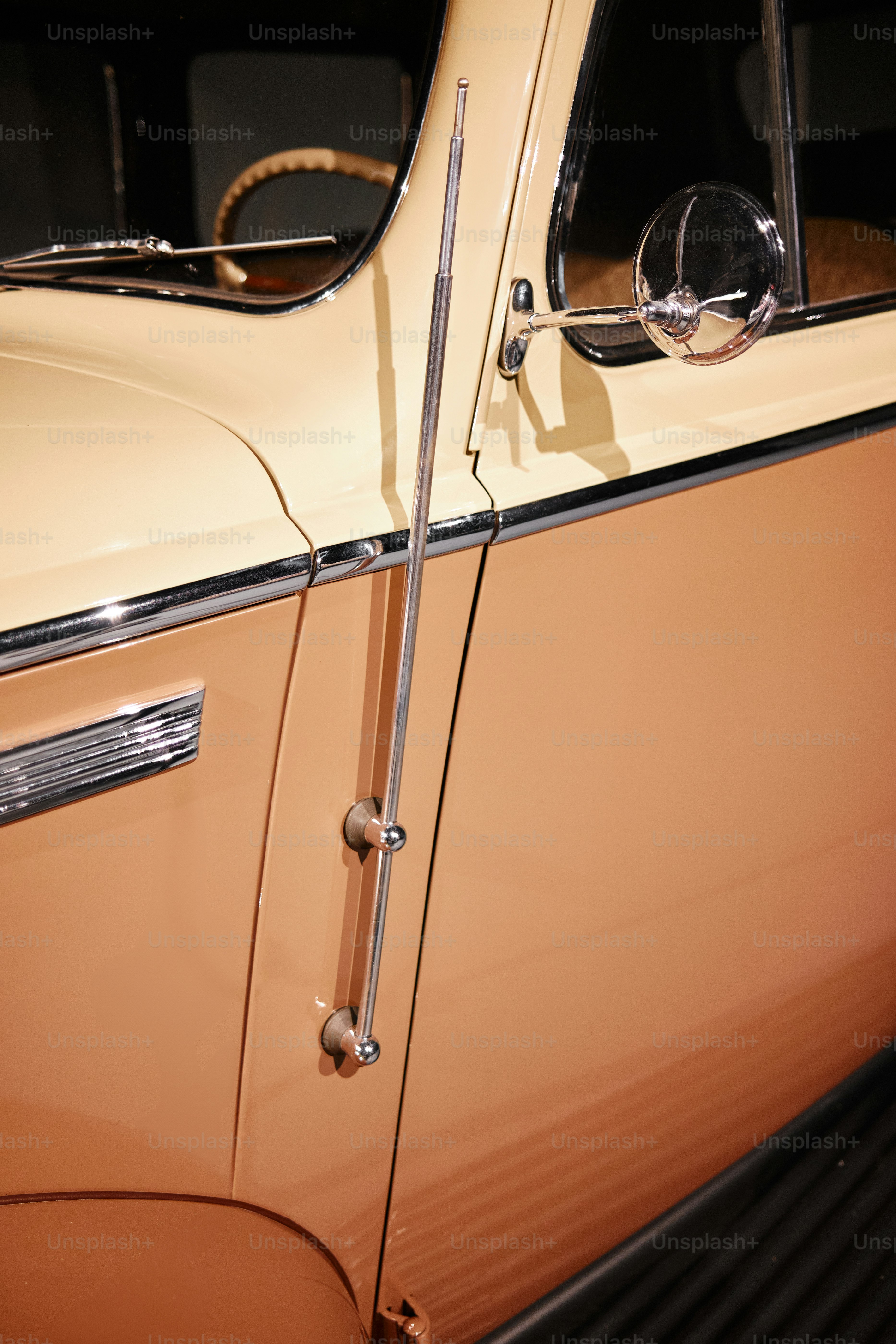 A tan car with a steering wheel and a window photo – Car Image on Unsplash