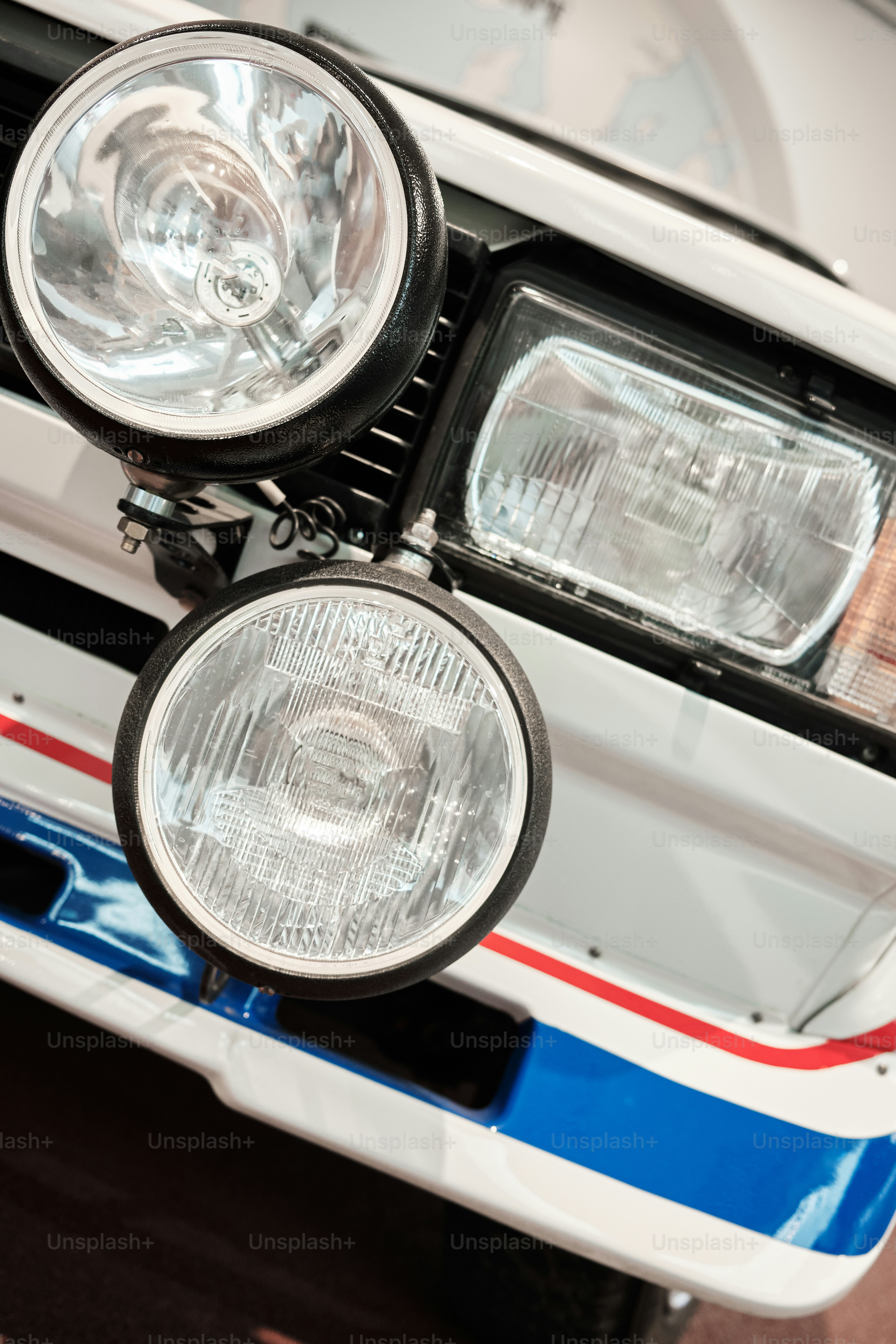 A close up of the front end of a car photo – Wallpaper 4k Image on Unsplash