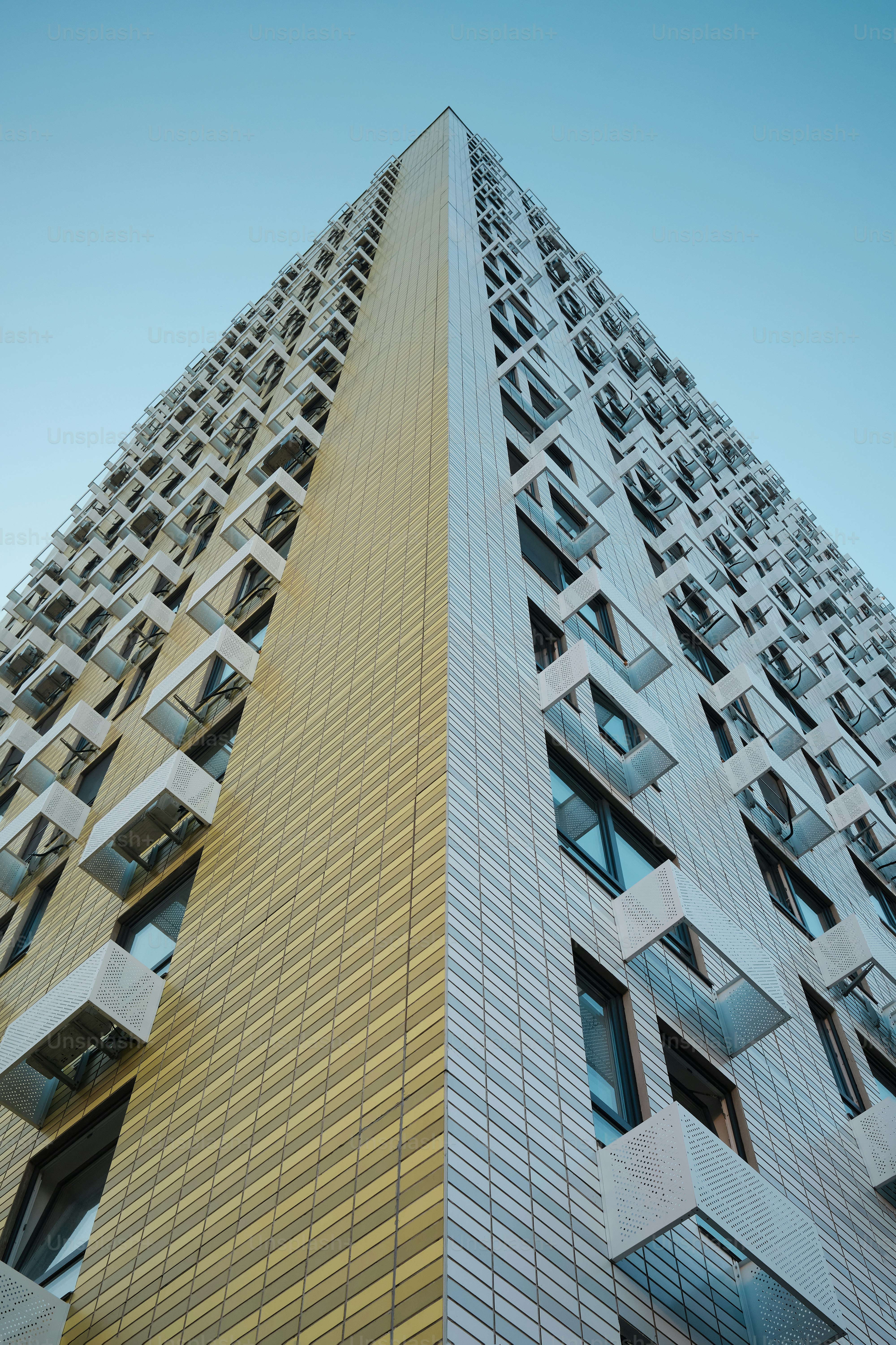 A tall red building with lots of windows photo – Colorful architecture ...