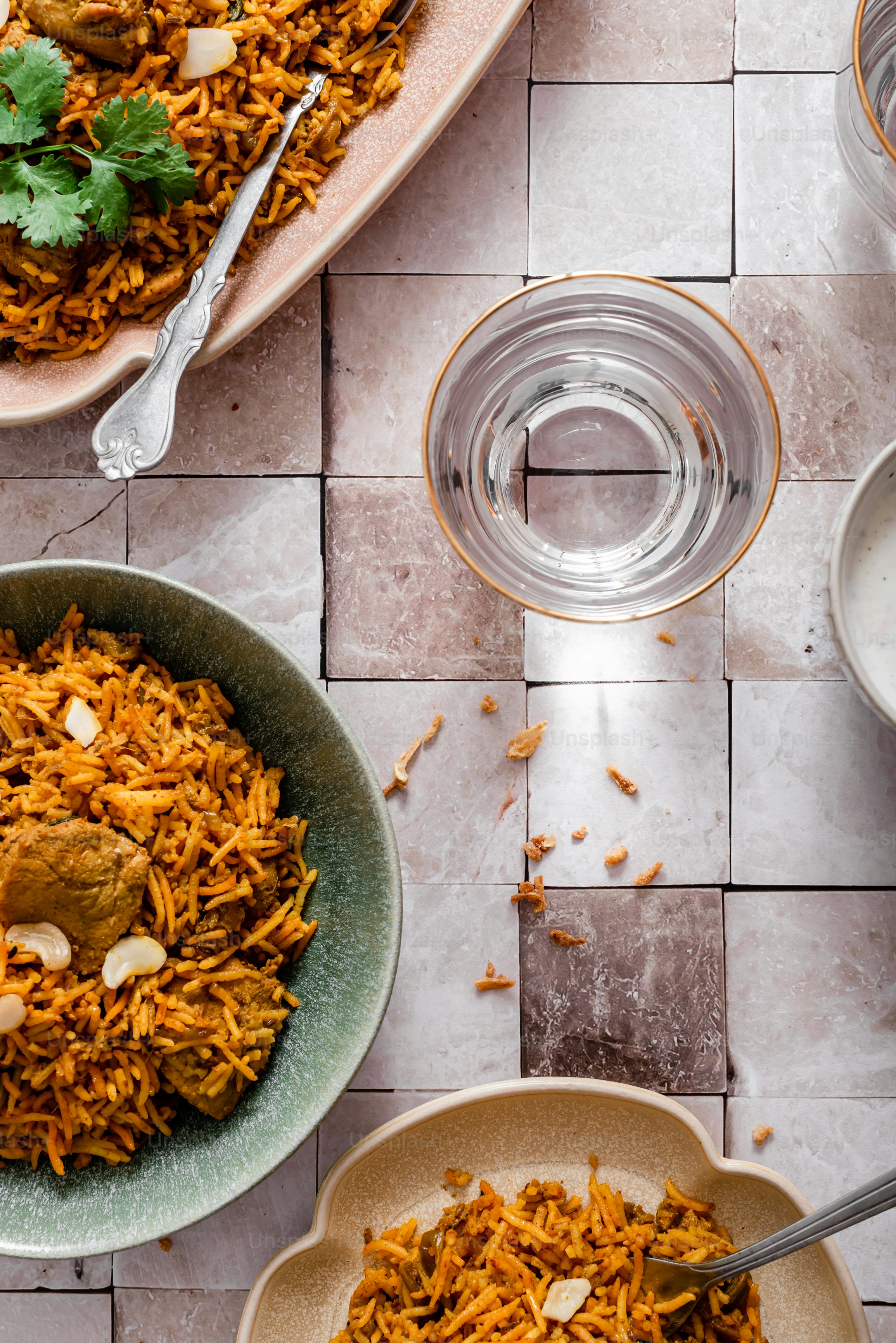 A table topped with plates of food and bowls of rice photo – Food Image ...