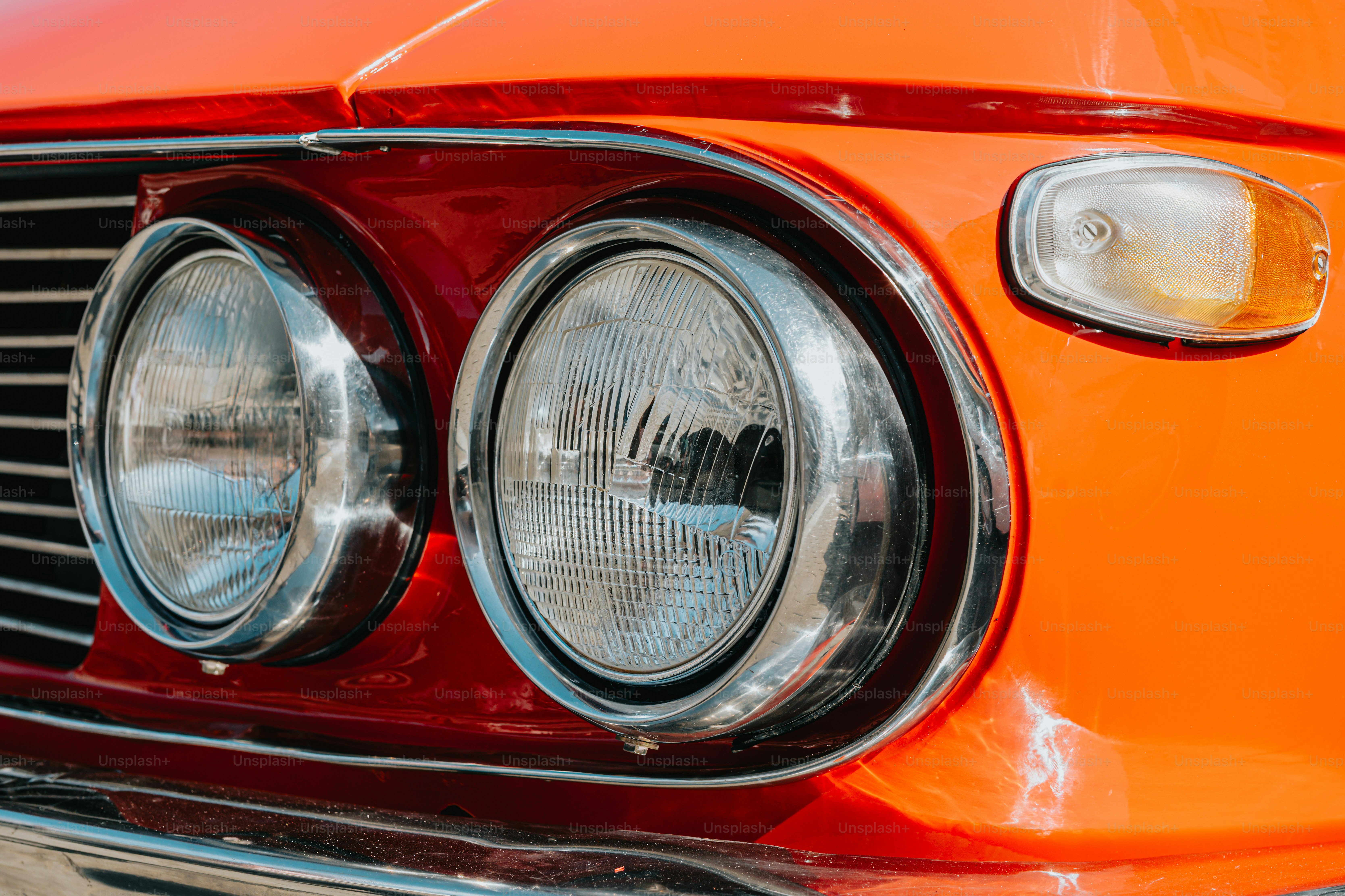 A close up of the front of an orange car photo – Car Image on Unsplash