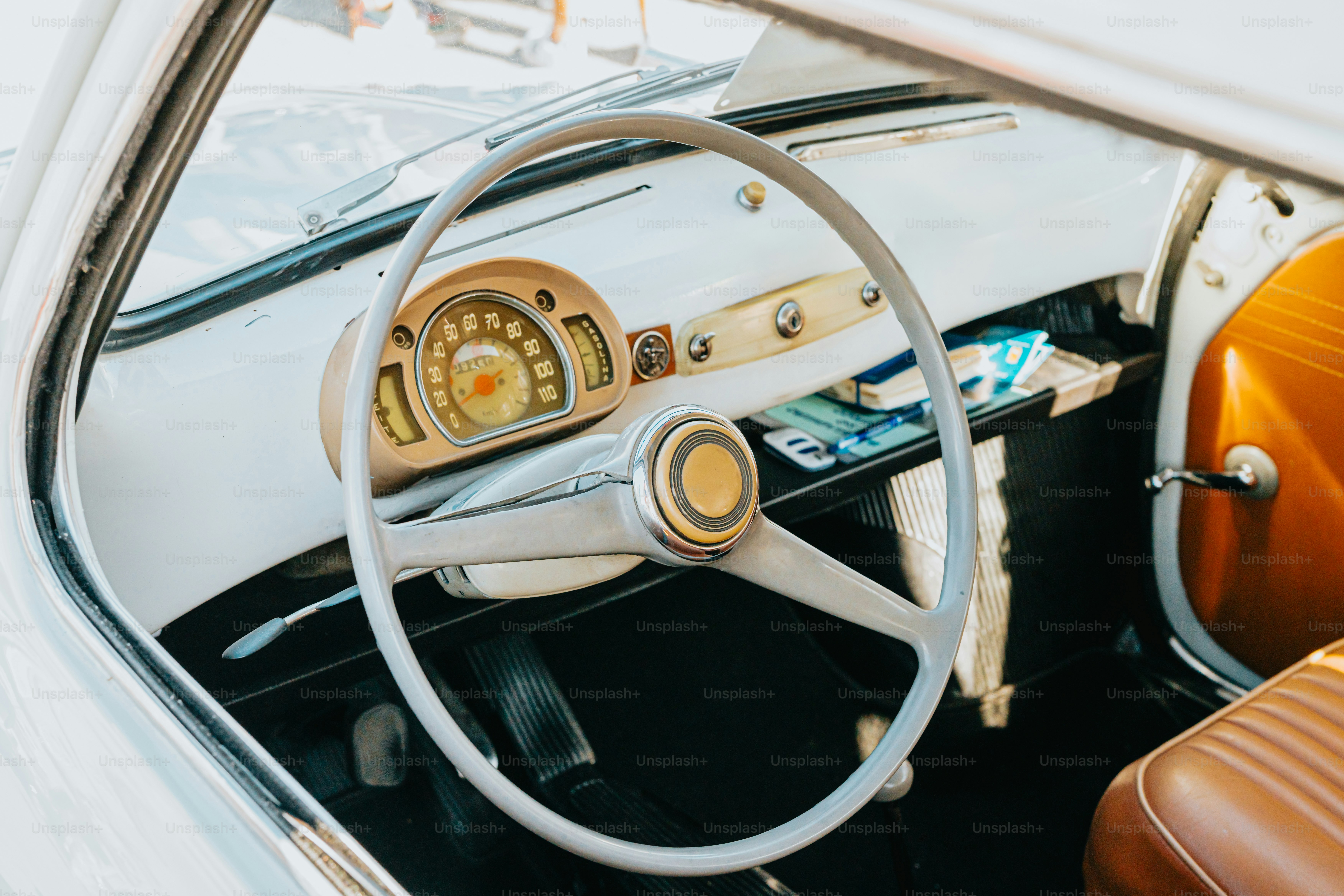 A car with a steering wheel and a dashboard photo – Car Image on Unsplash