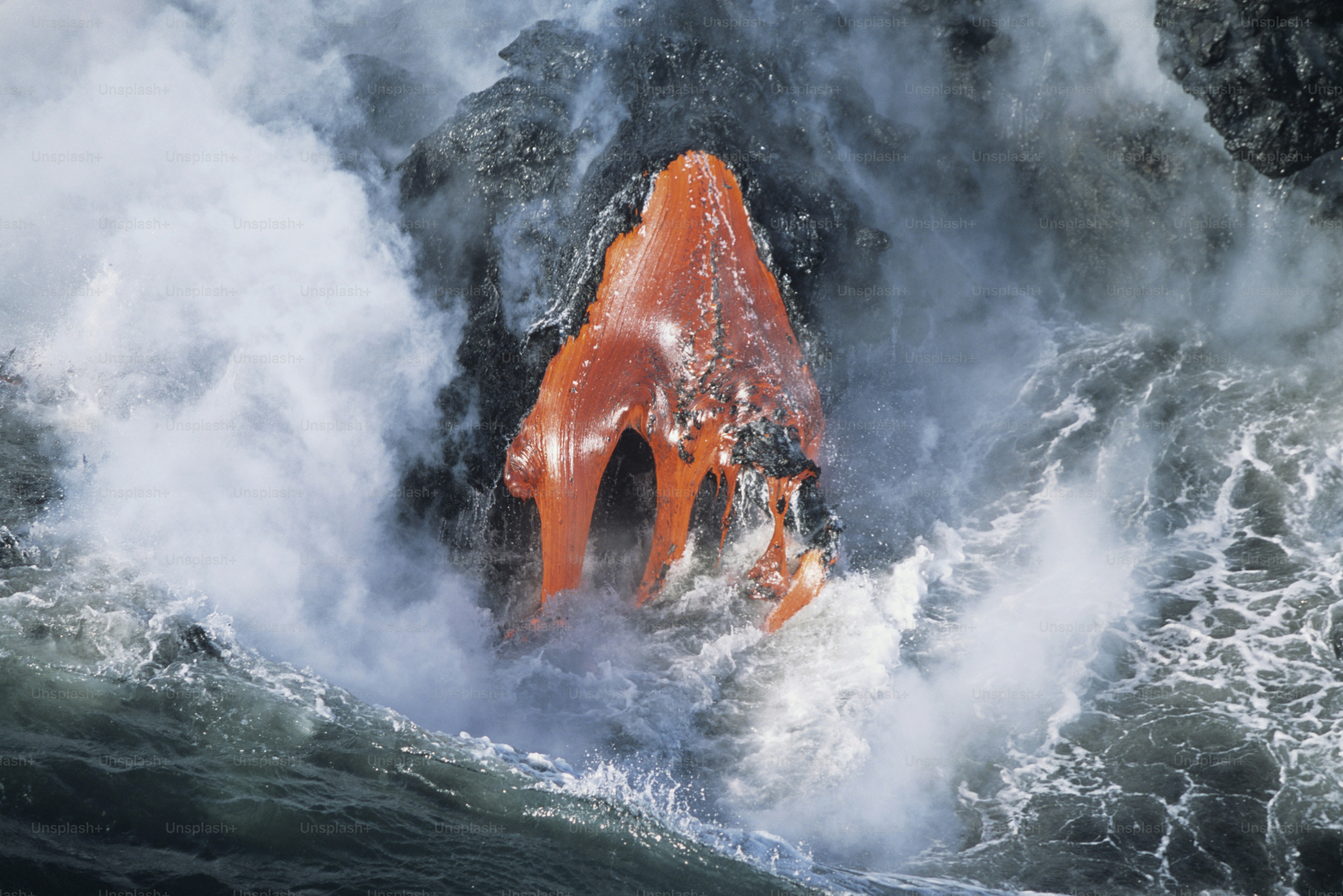 A large orange object floating on top of a body of water photo ...