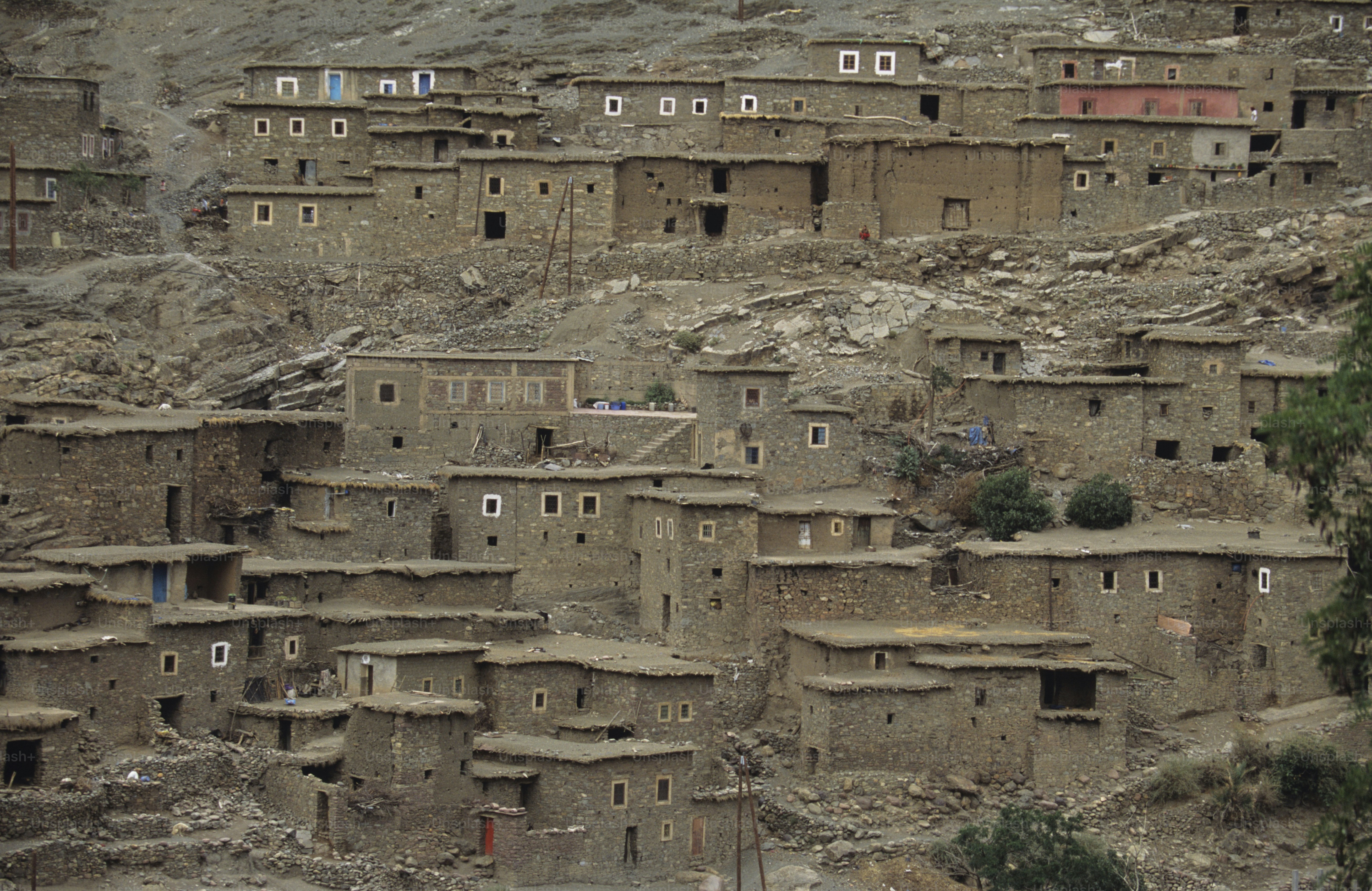 A group of buildings built into the side of a mountain photo – History ...