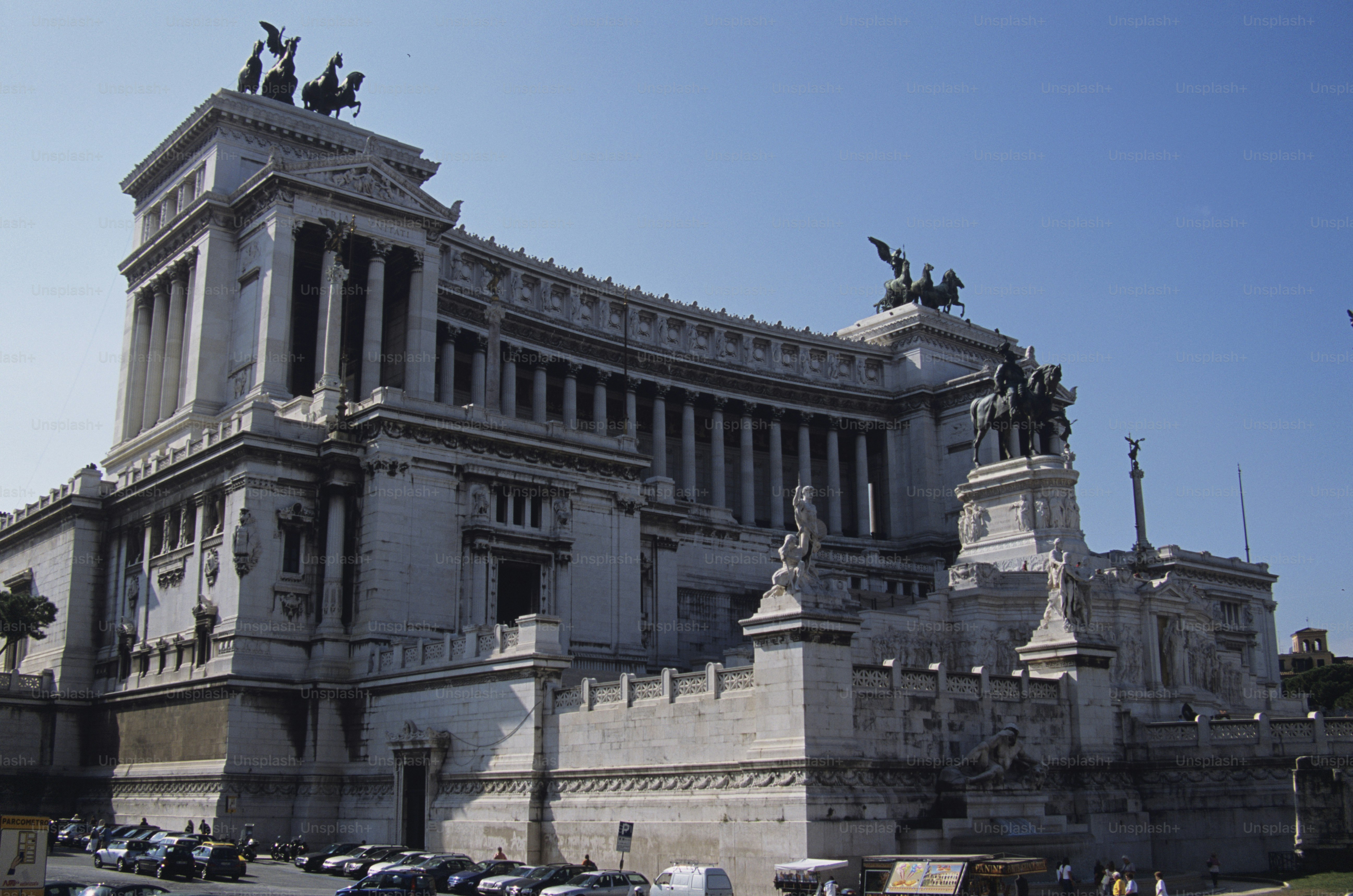 A large building with statues on top of it photo – Success Image on ...