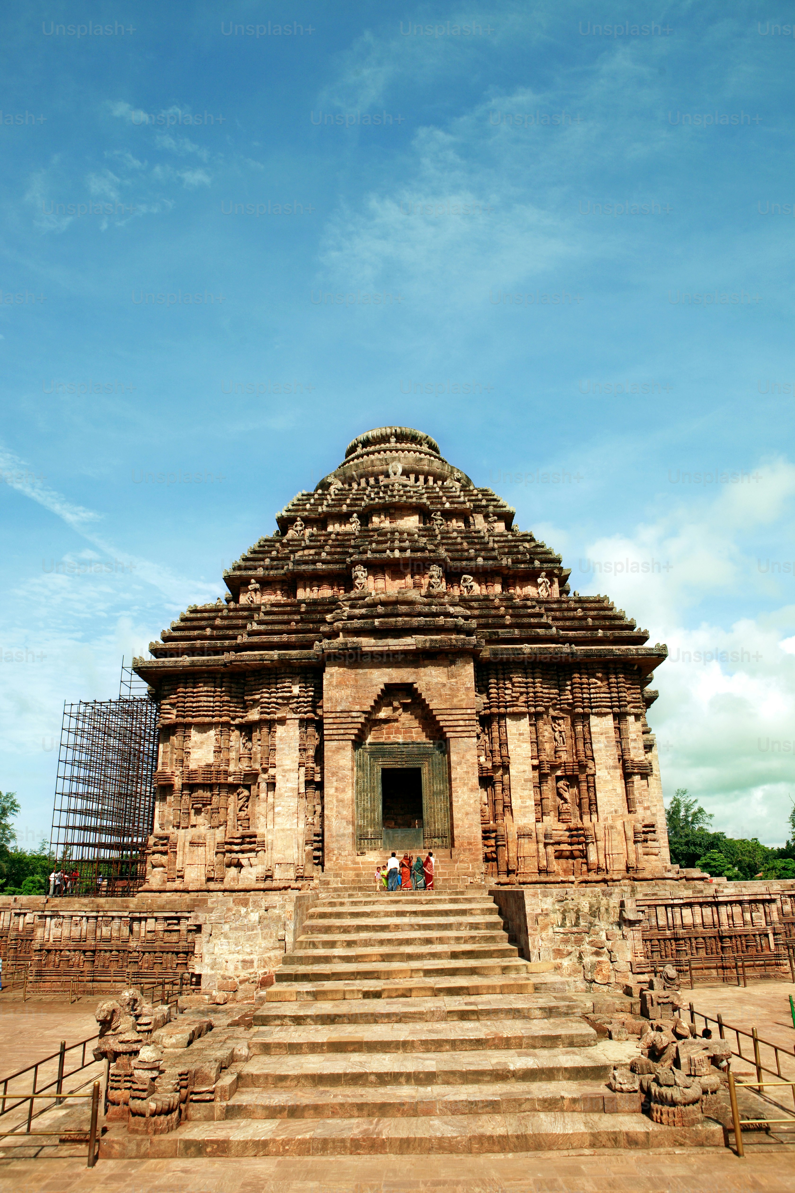 A large stone structure with steps leading up to it photo – Day Image ...