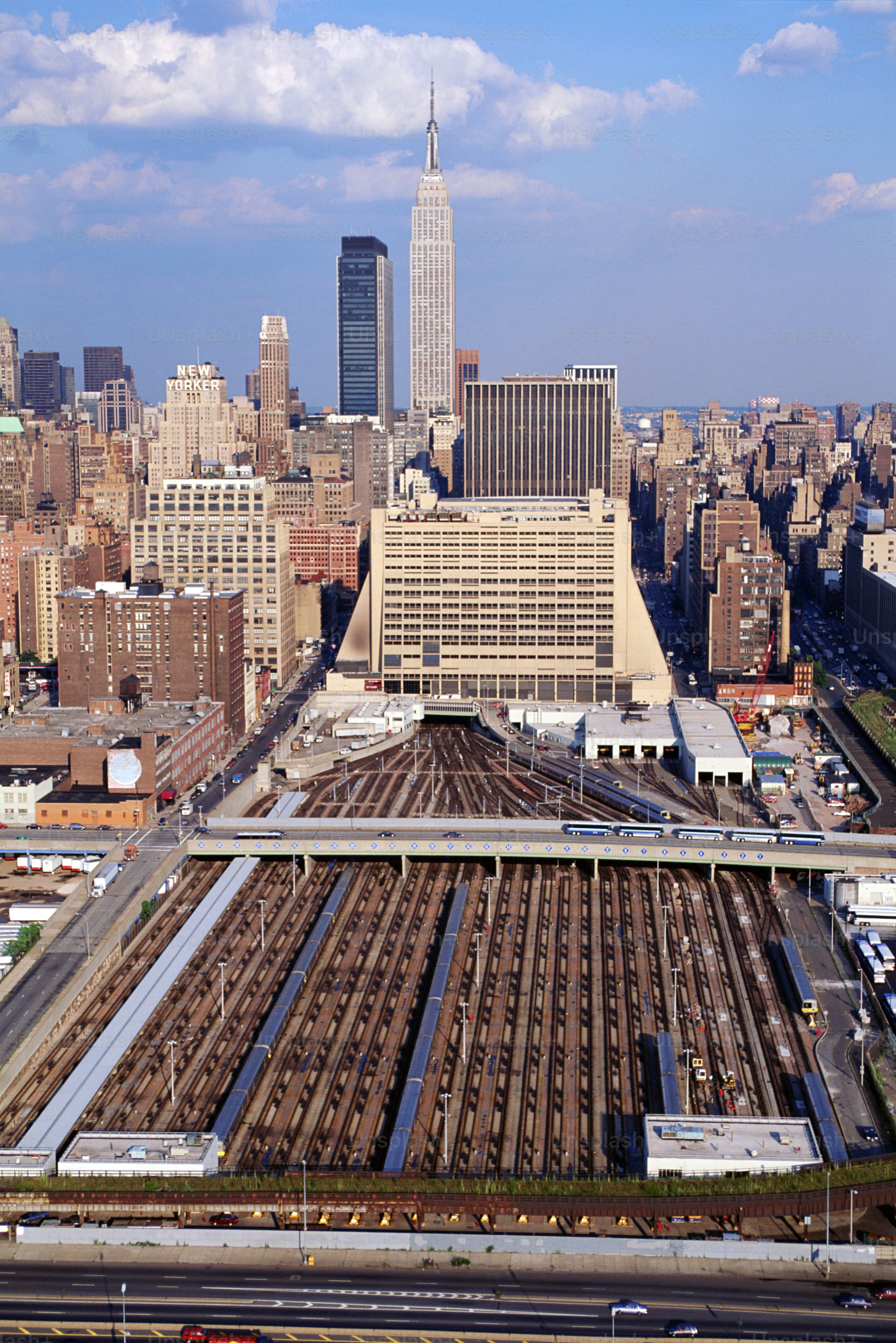 A train yard in the middle of a city photo – Industry Image on Unsplash