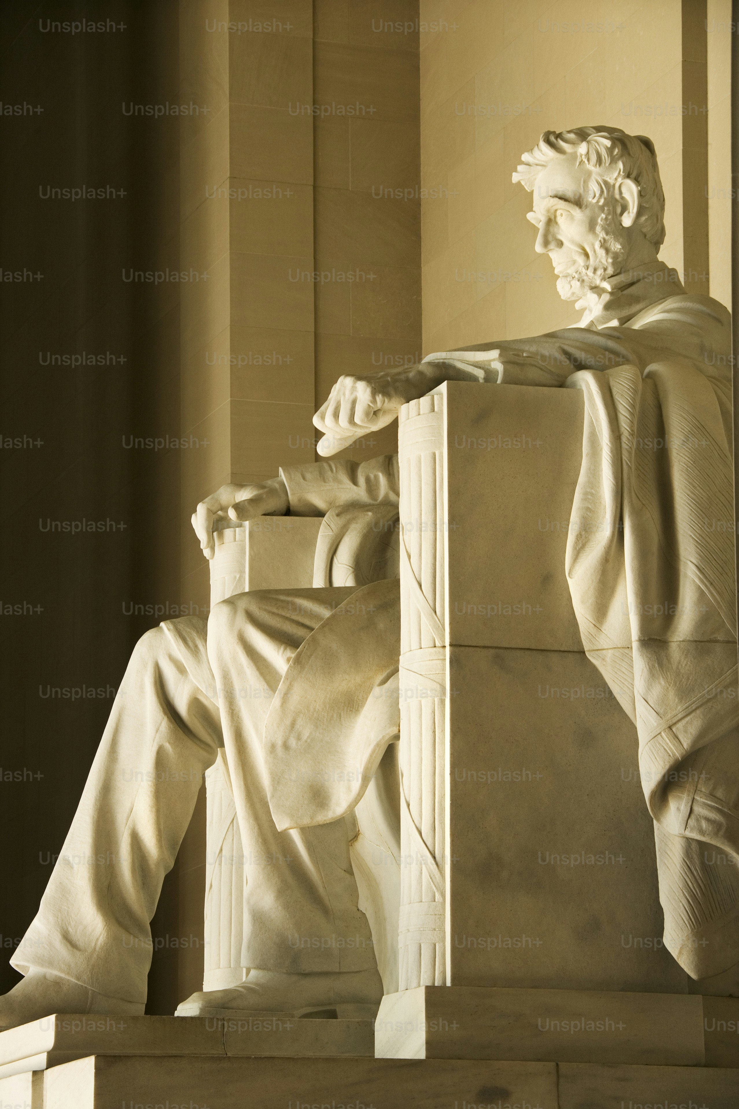 A statue of a man sitting in a chair photo – Indoors Image on Unsplash