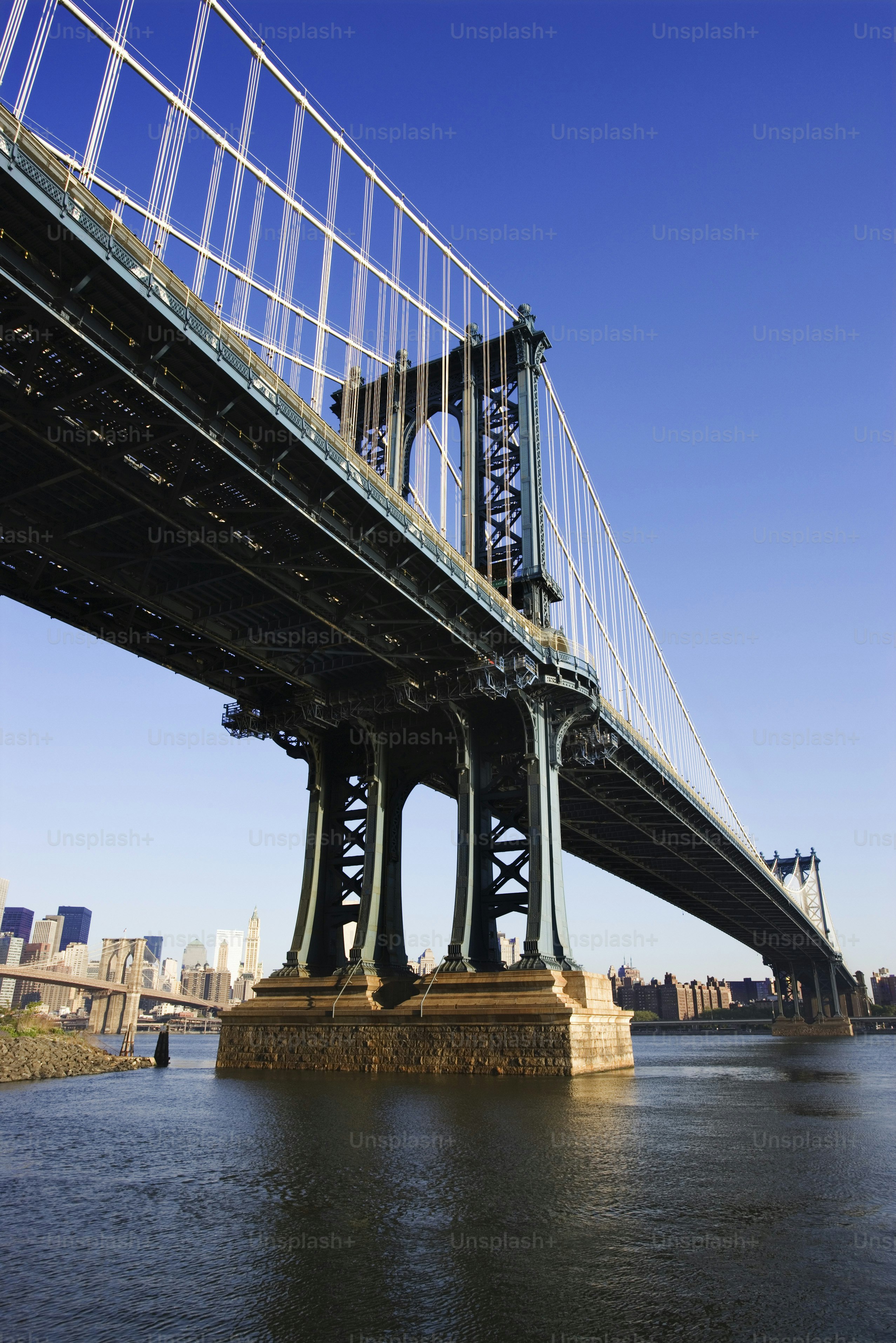 A large bridge spanning over a large body of water photo – Copy space ...