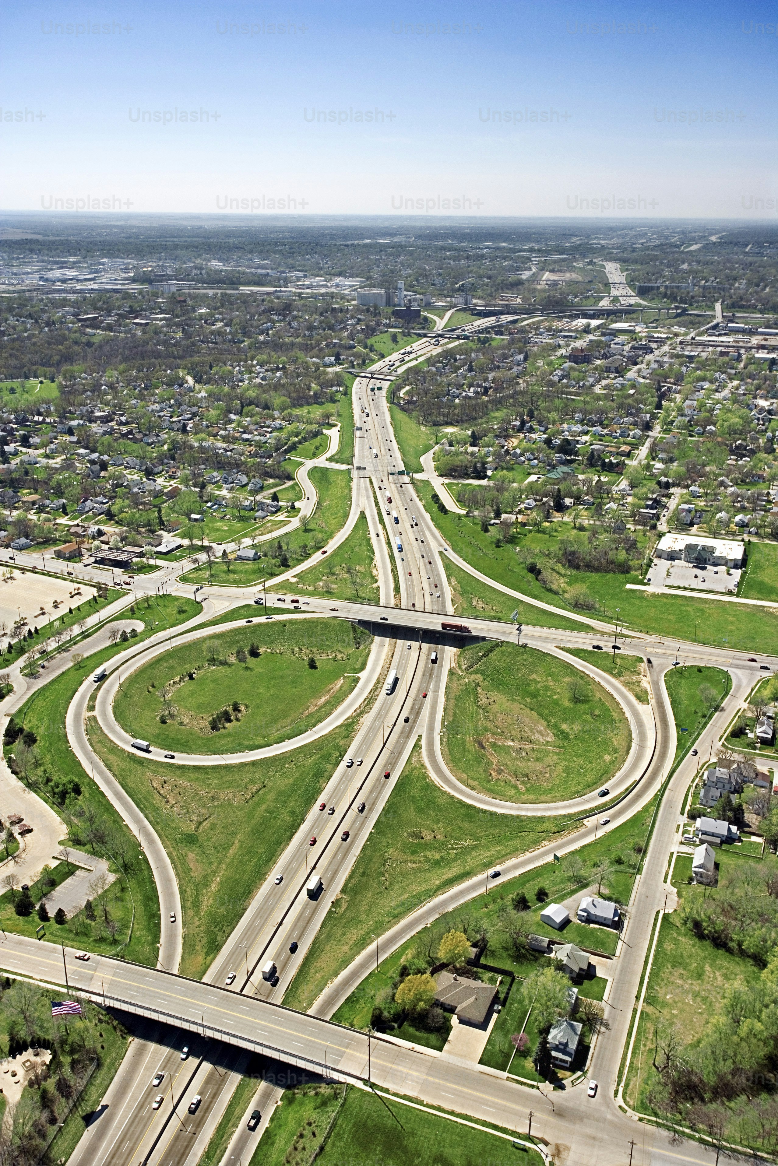 An aerial view of a highway intersection in a city photo – Copy space ...