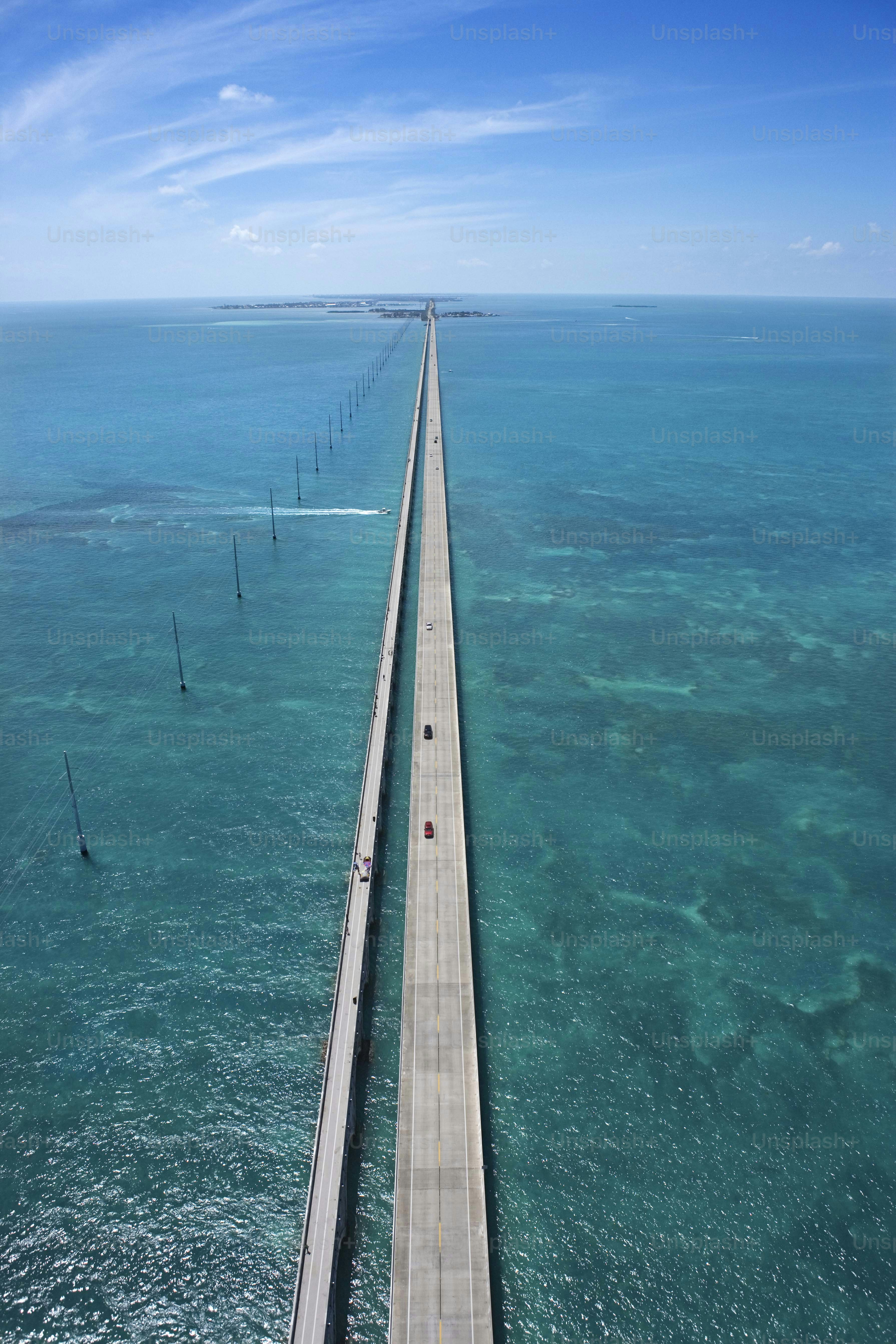 A long bridge over a body of water photo – Gulf coast states Image on ...