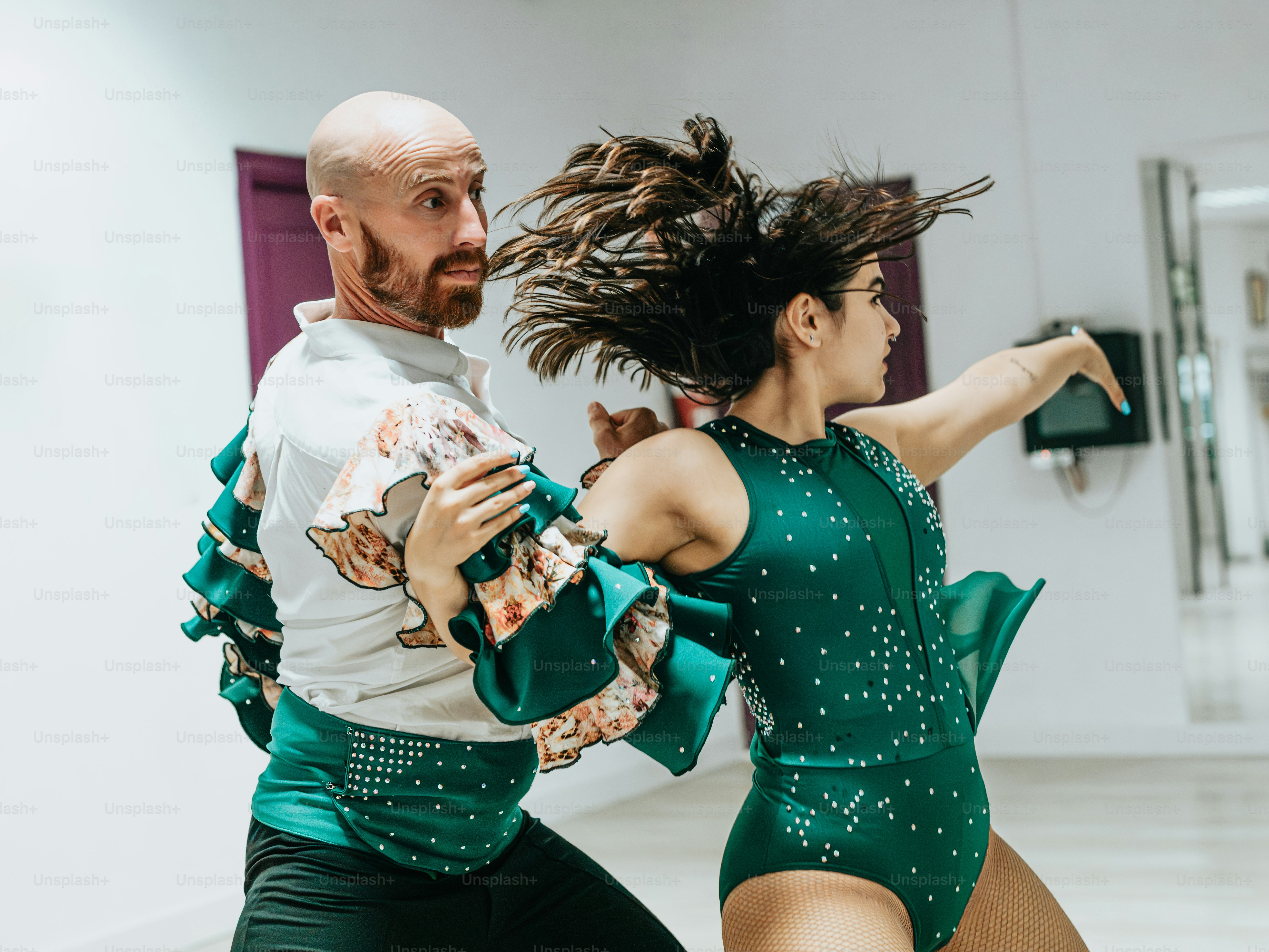 A man and a woman dancing in a dance studio photo – Rehearsal Image on ...