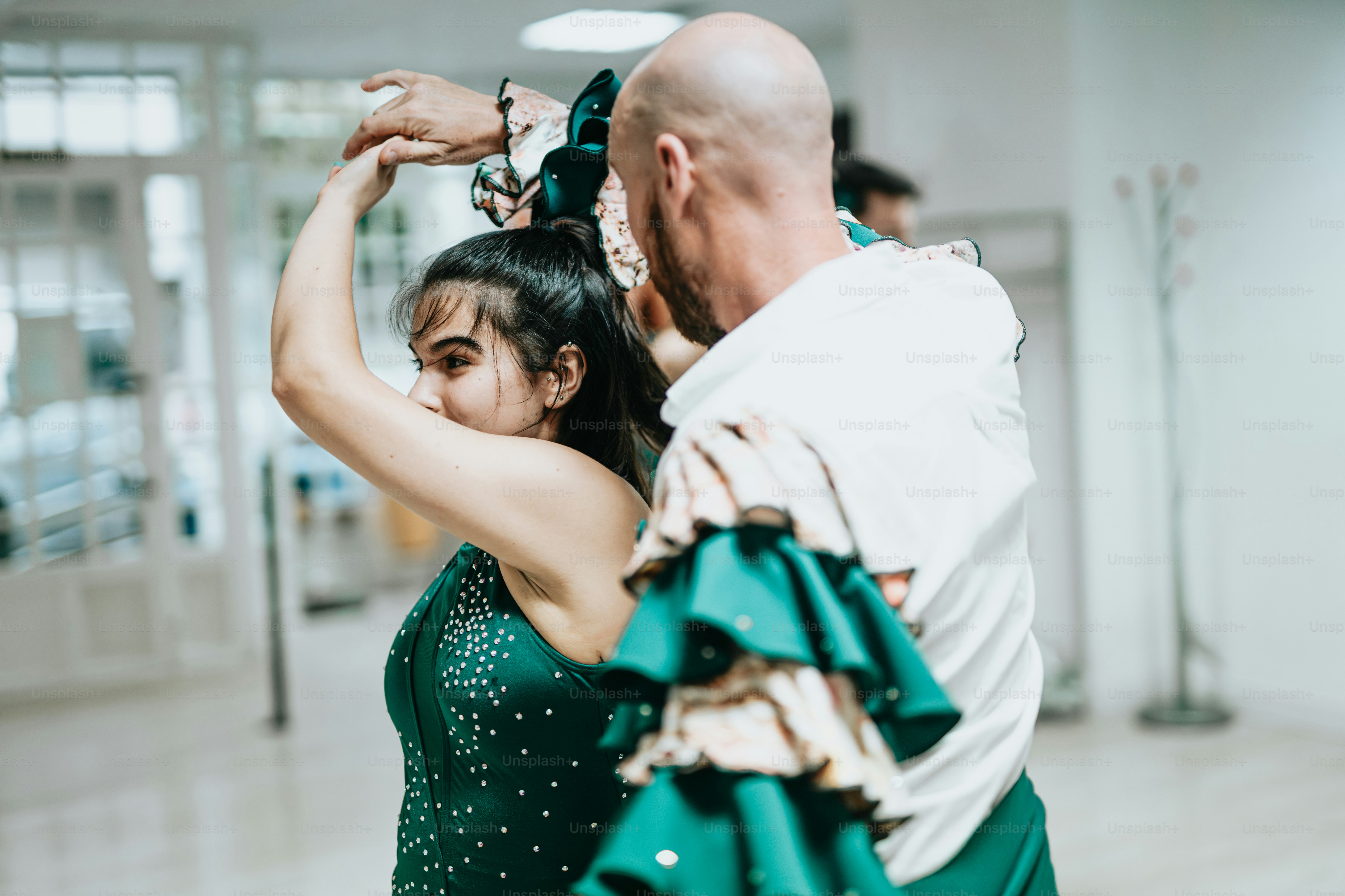 A man and a woman dance together in a dance studio photo – Music Image ...