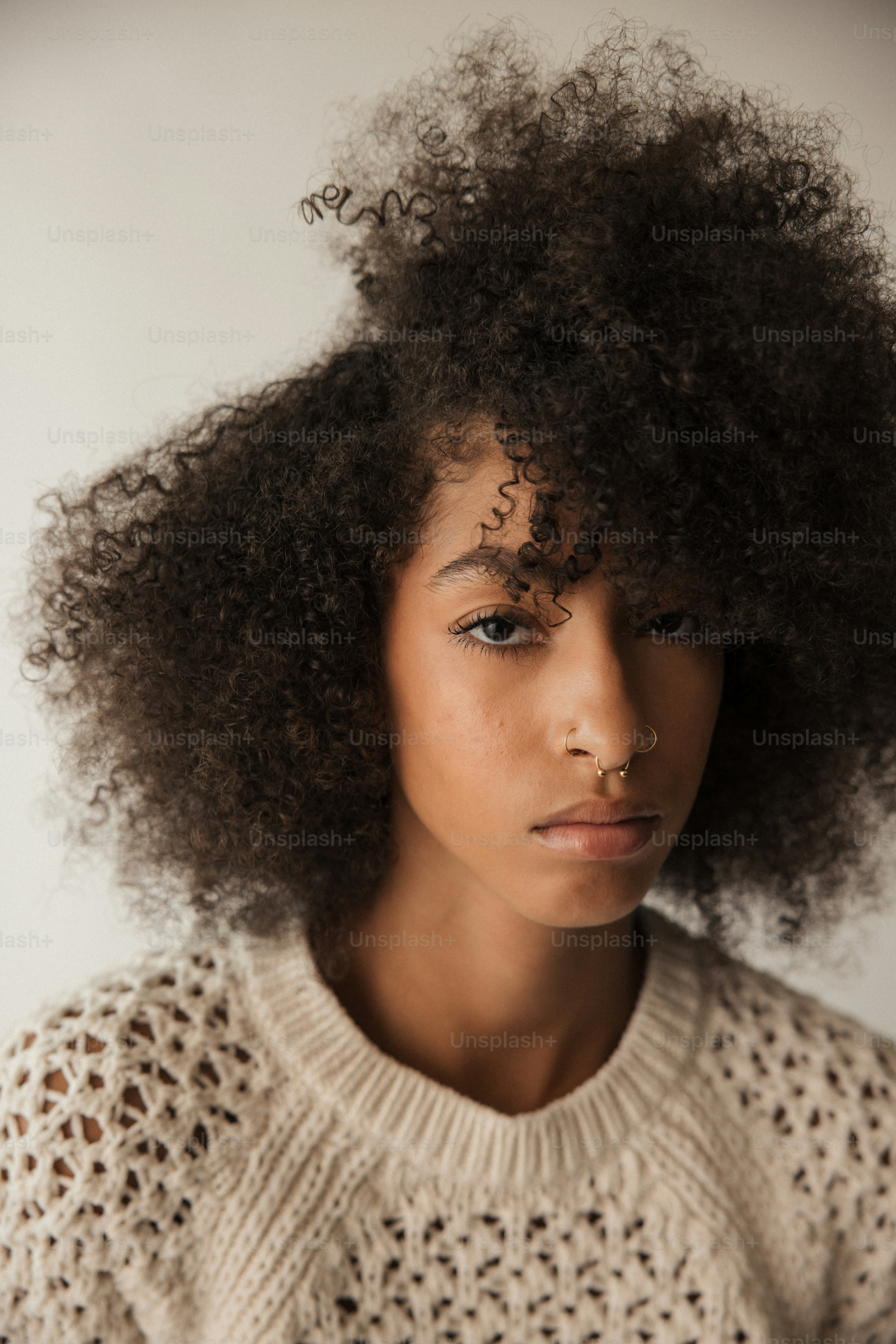 A close up of a person with an afro photo – Woman Image on Unsplash