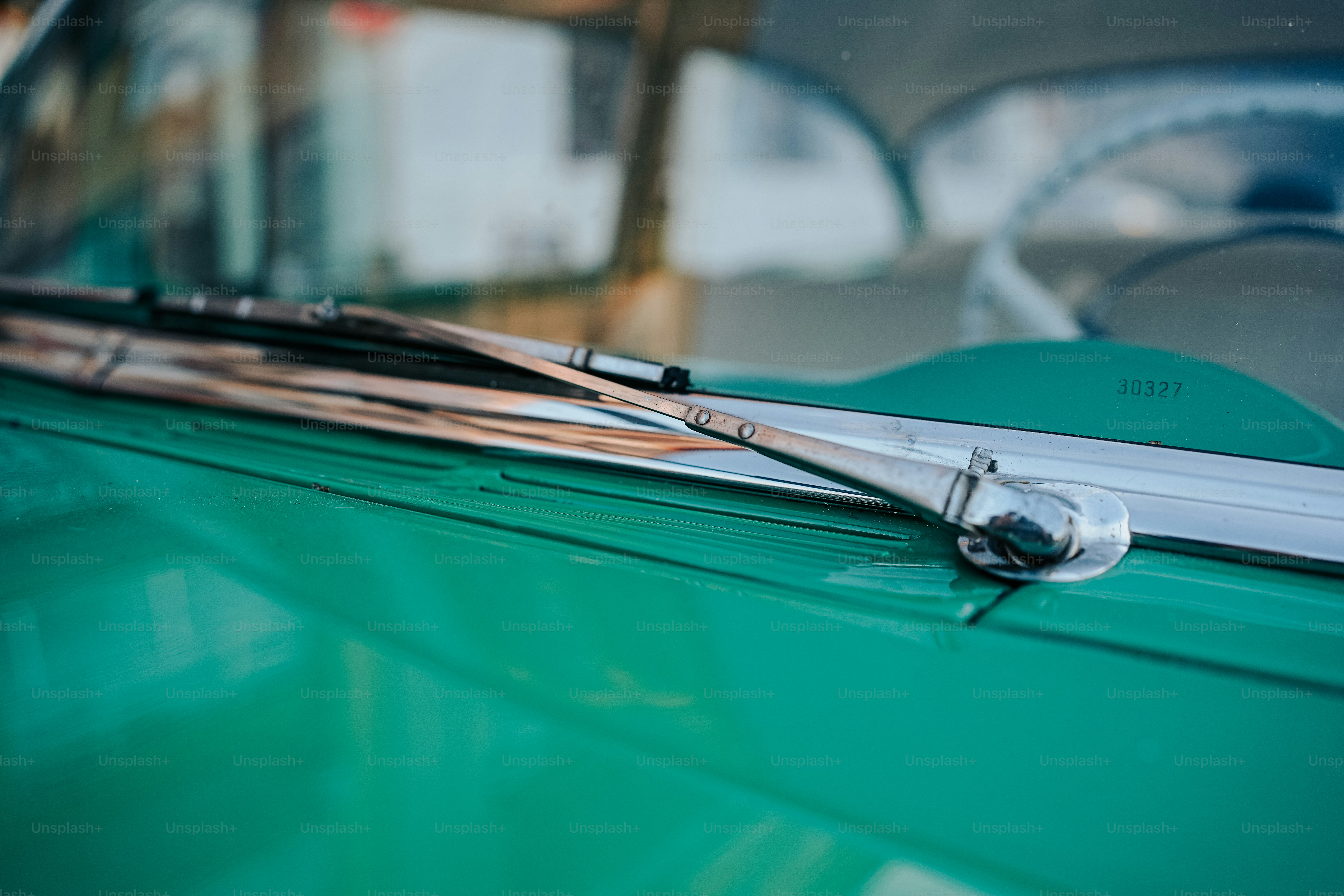 A close up of a green car with a metal handle photo – Car Image on Unsplash