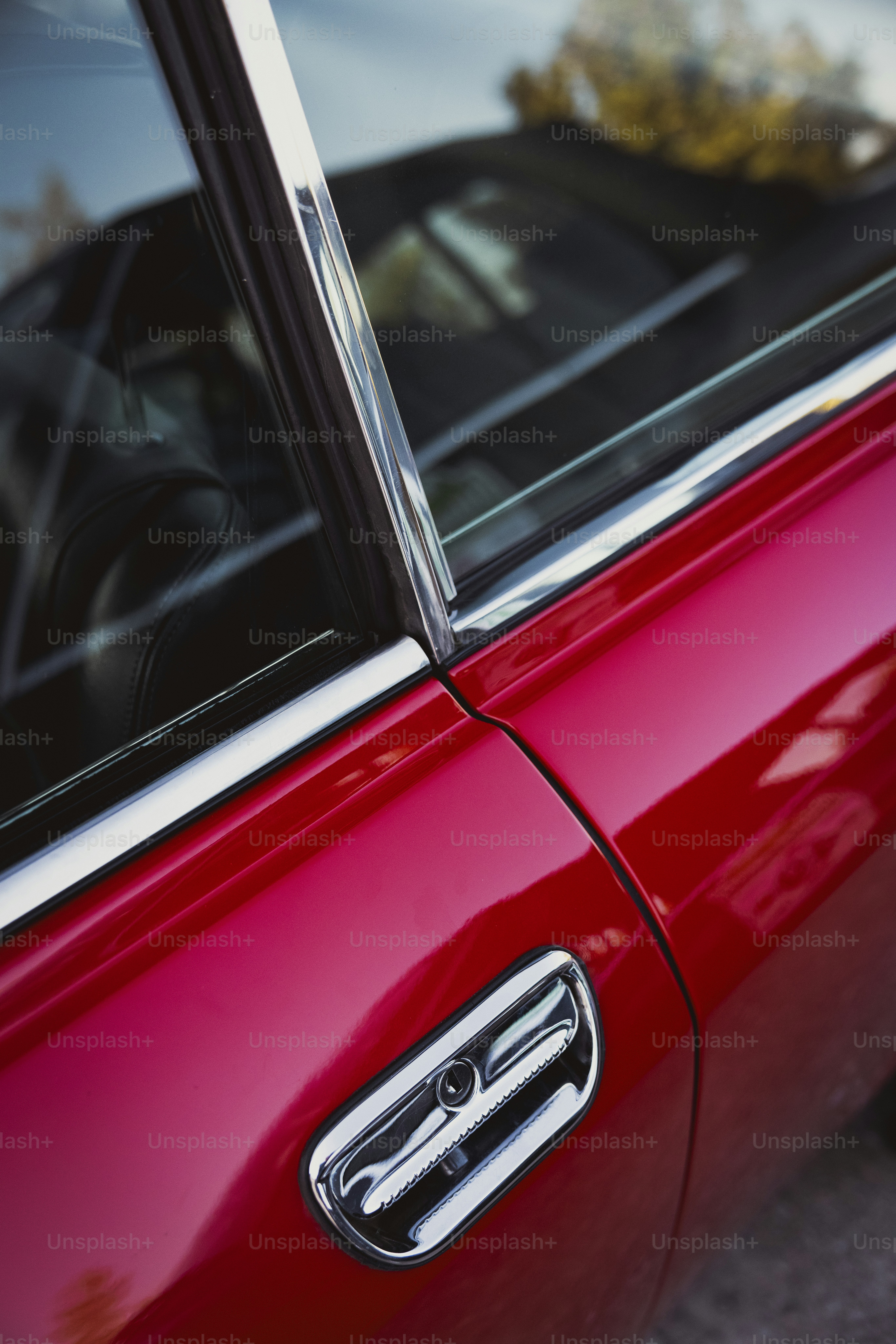 A close up of a red car with its door open photo – Car Image on Unsplash