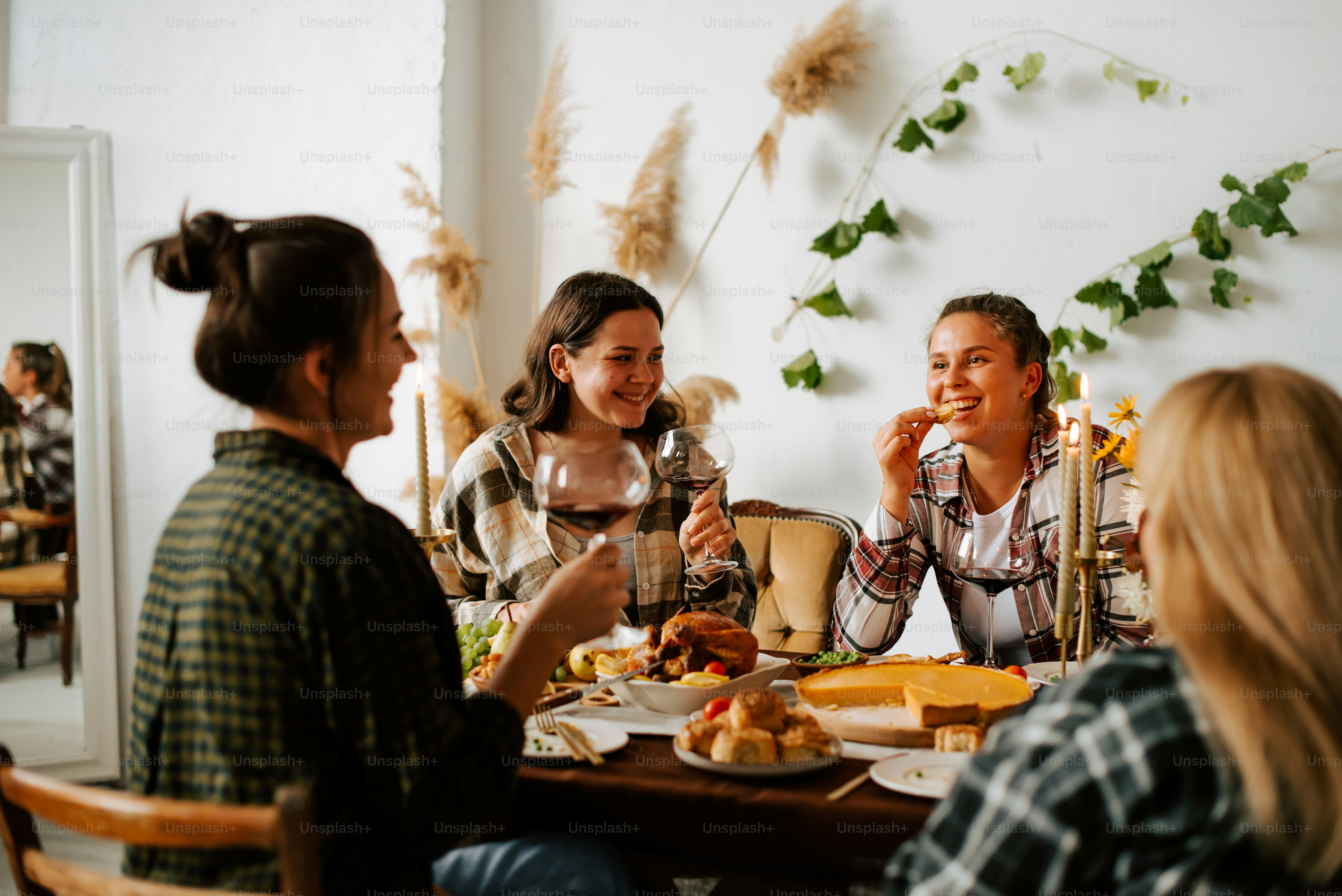 A group of women sitting around a table eating food photo – Thanks ...