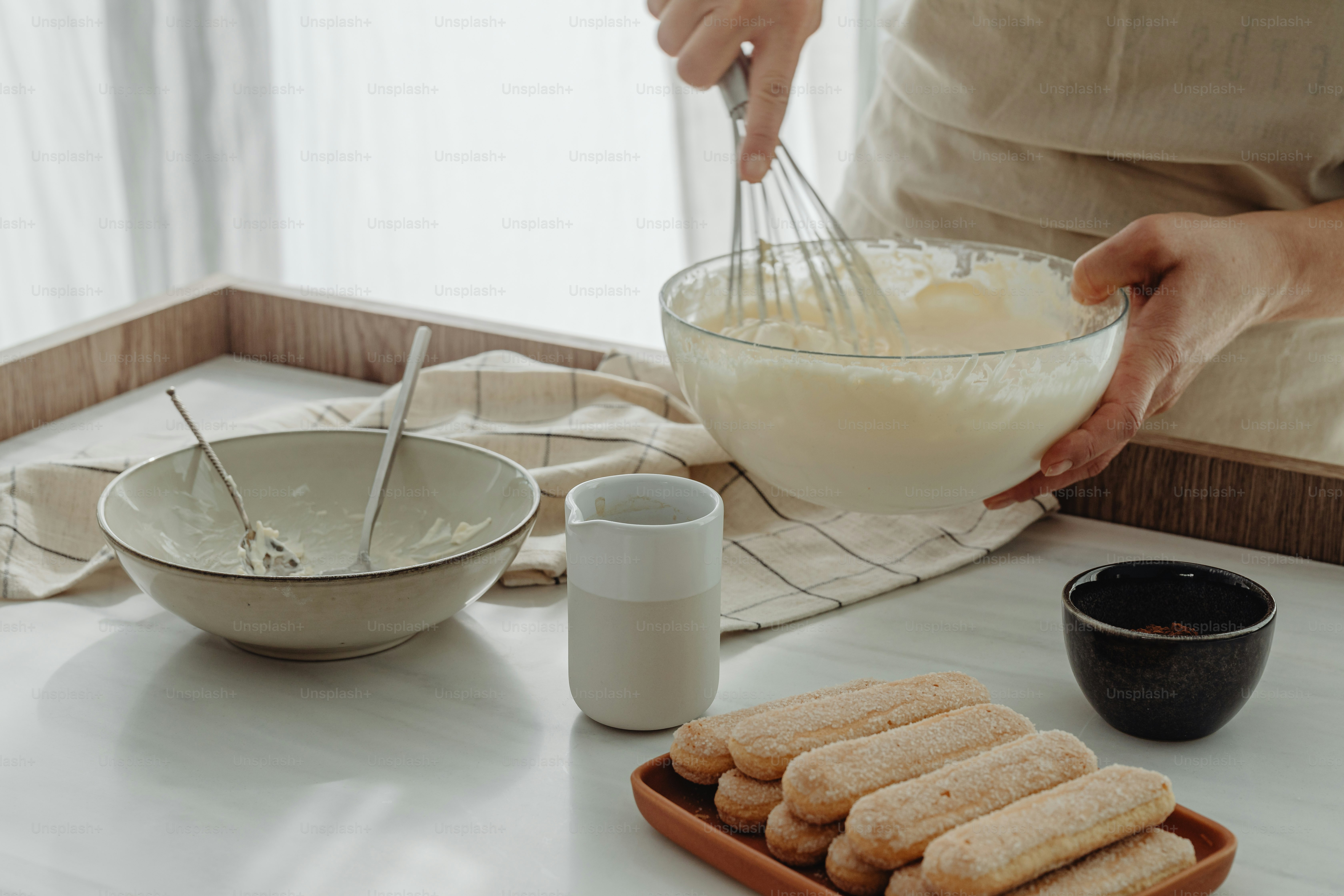 A person whisking cookies in a bowl with a whisk photo – Tiramisu Image ...