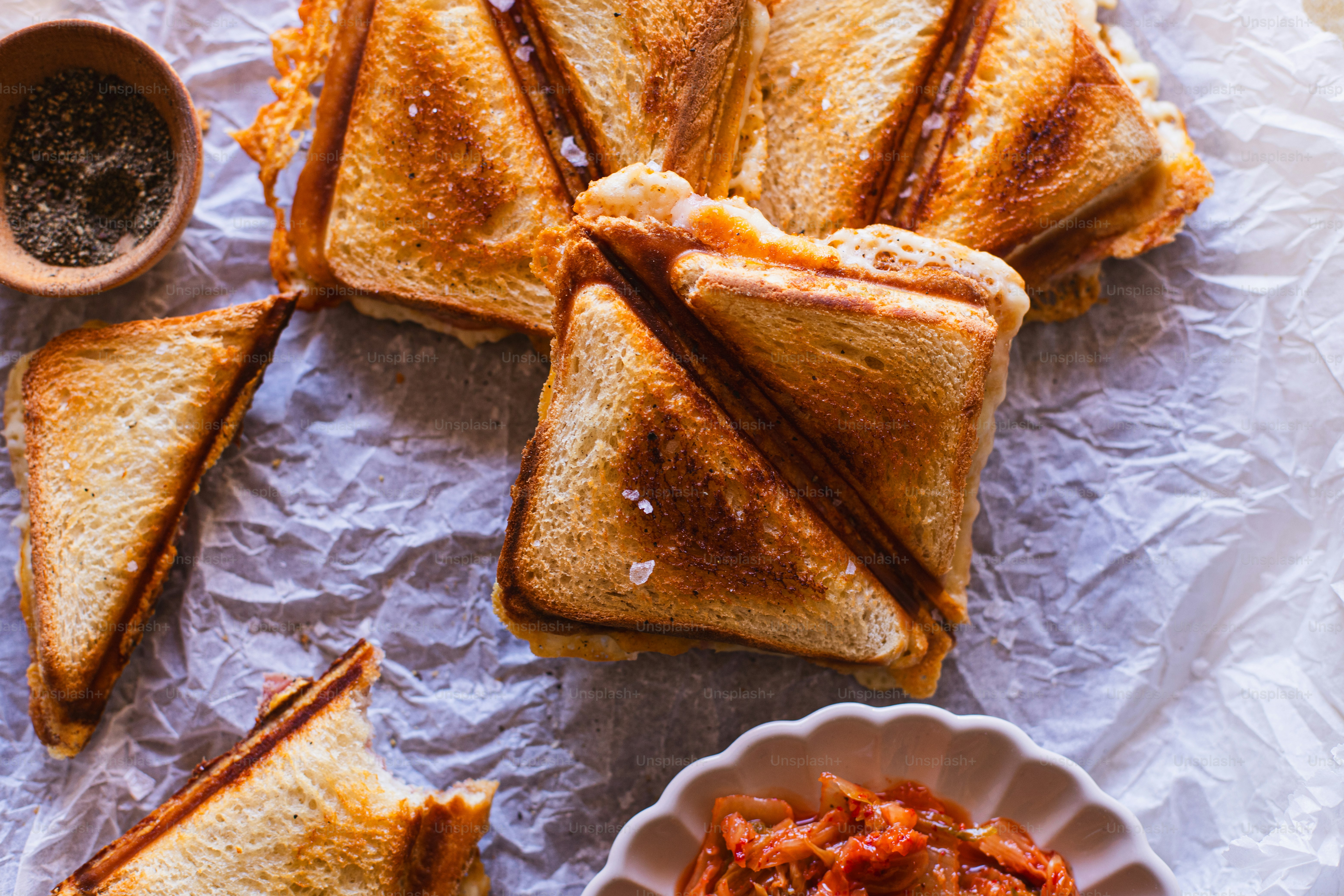 A plate of toasted sandwiches and a bowl of chili photo – Food Image on ...