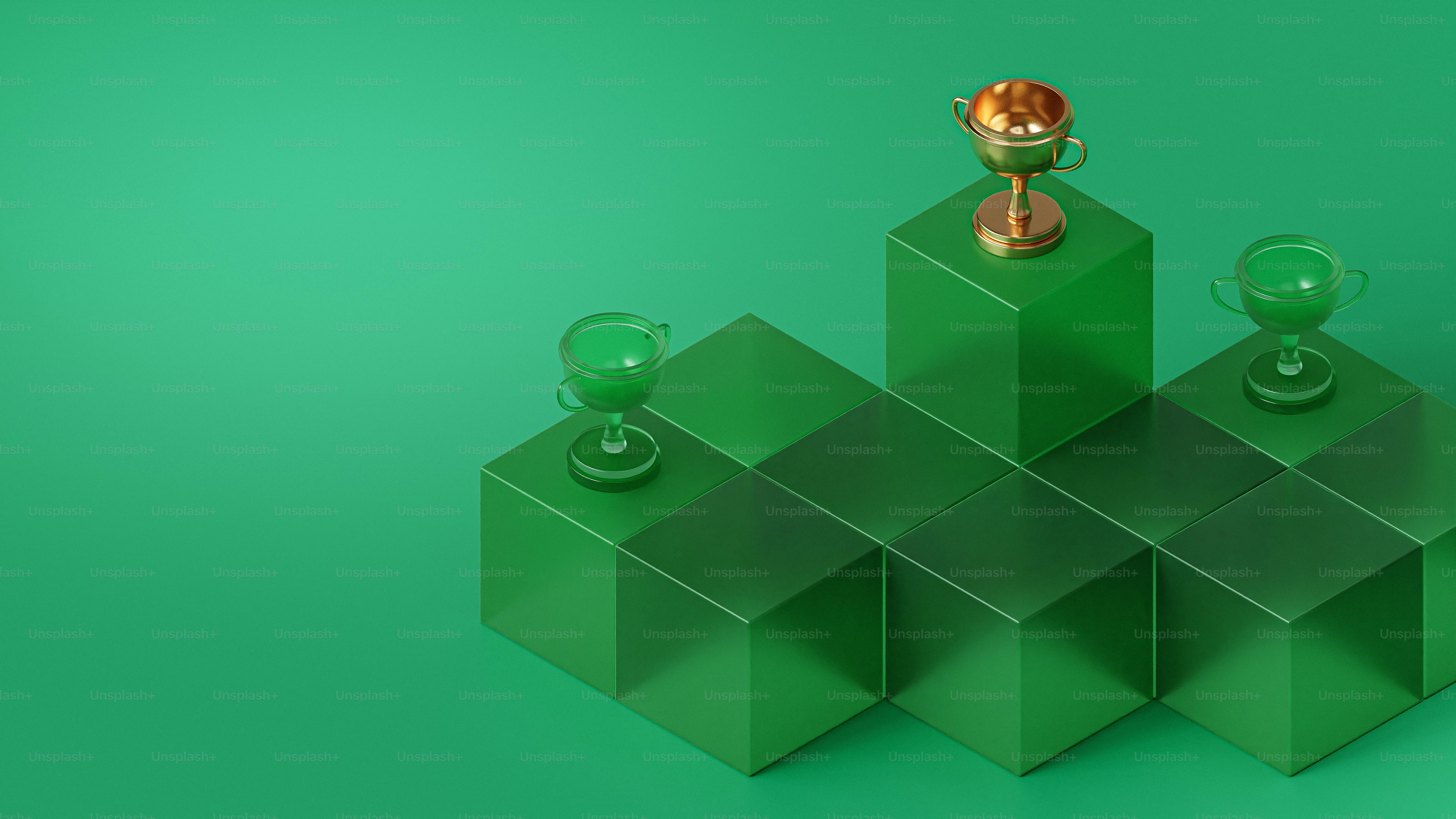 A gold trophy sitting on top of a green pyramid photo – Success Image ...