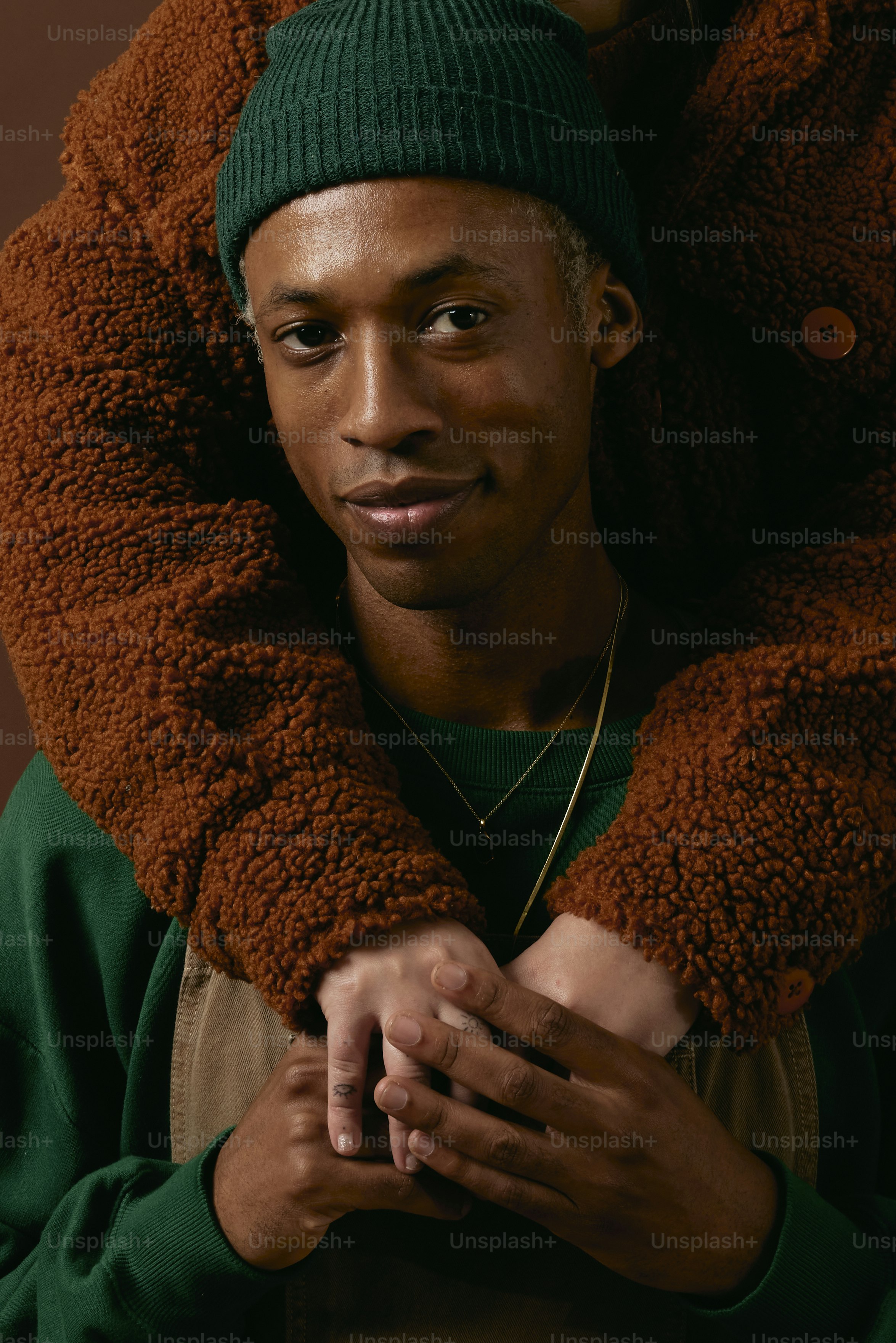 A man is holding a large stuffed animal on his shoulders photo ...