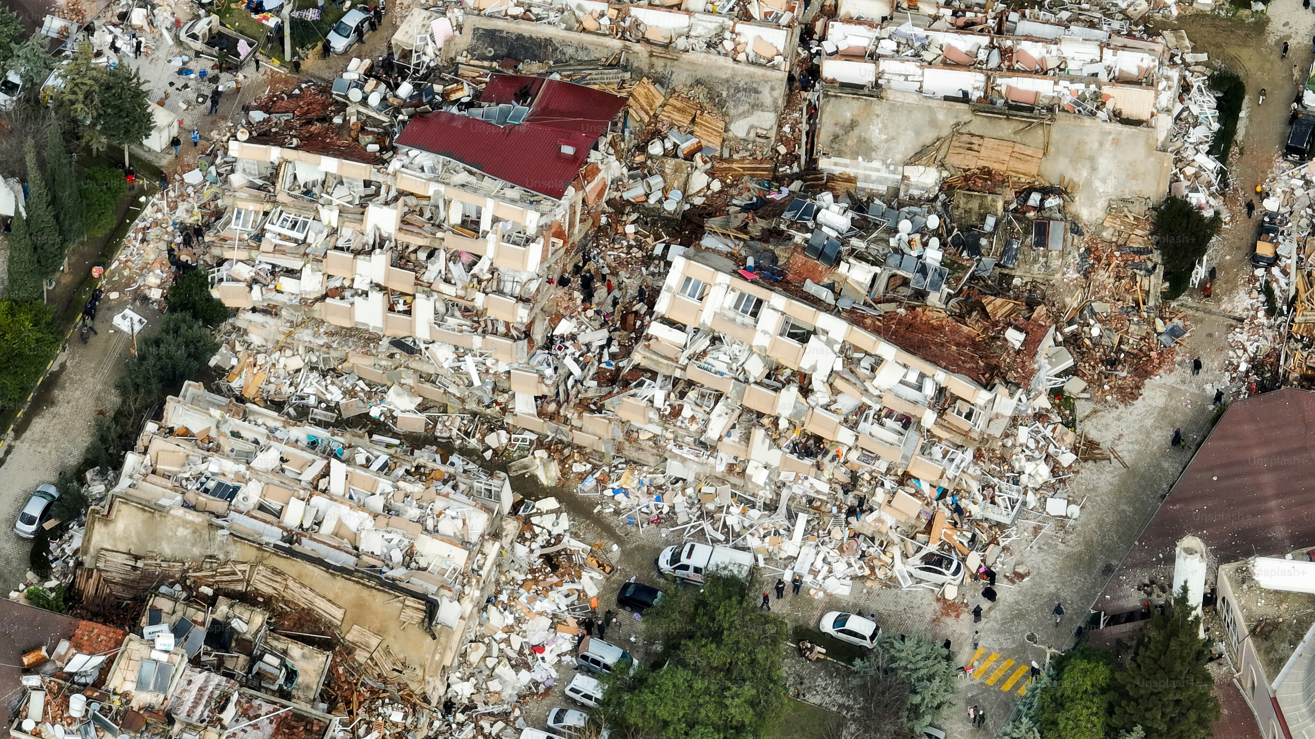 An aerial view of a building that has been destroyed photo – Earthquake ...