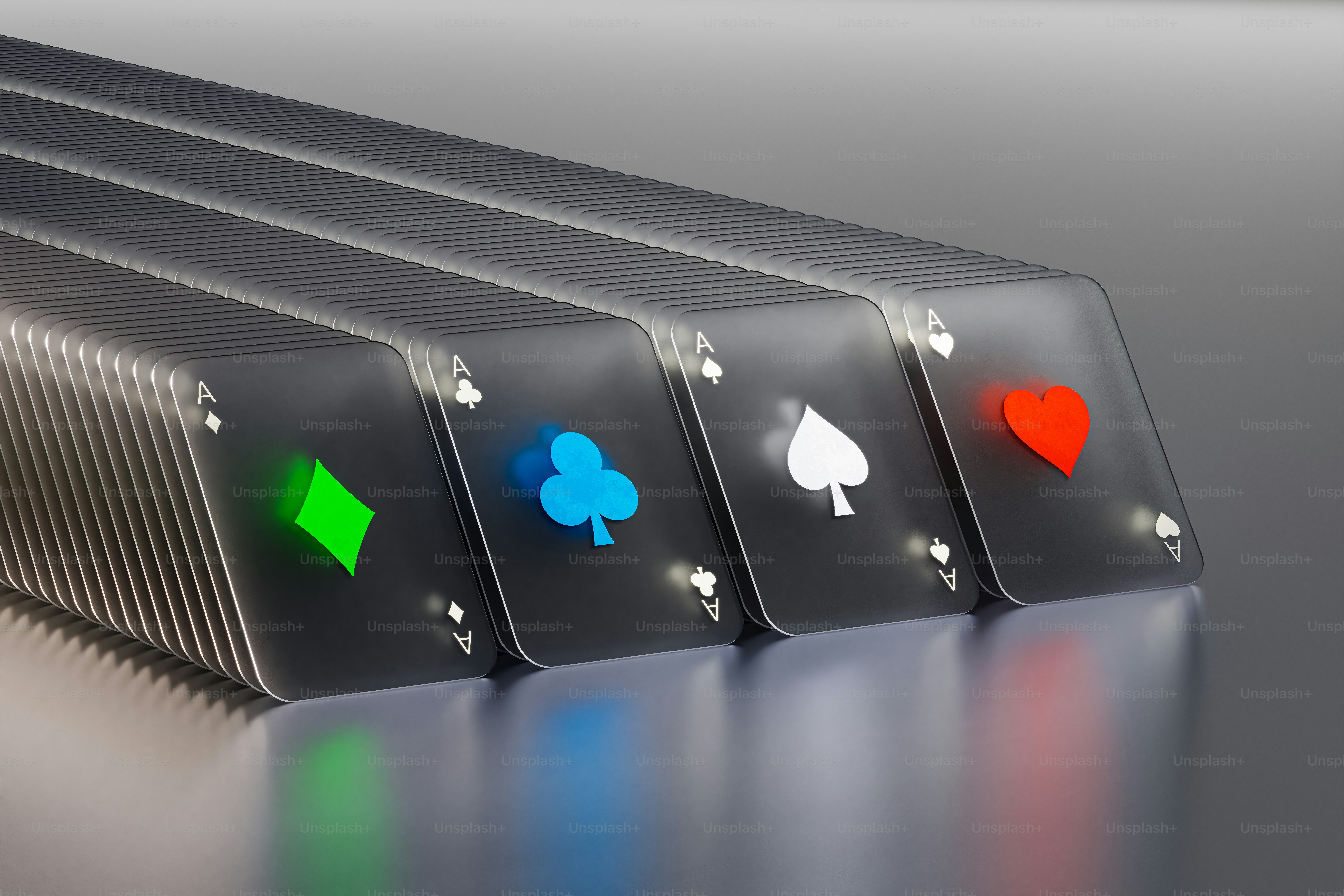 A row of four playing cards on a table photo – Casino Image on Unsplash