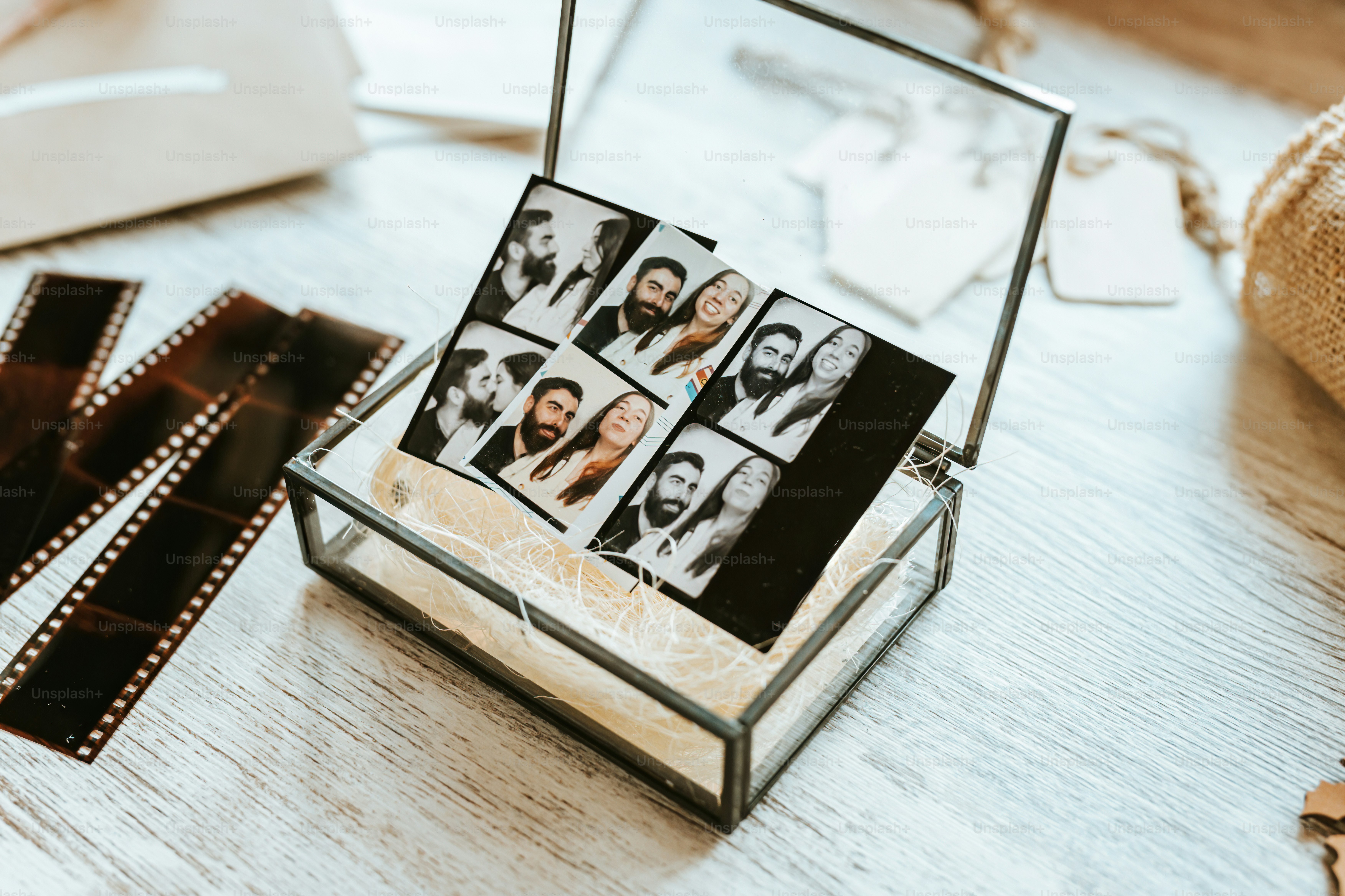 A glass box filled with pictures of people photo – Analog Image on Unsplash