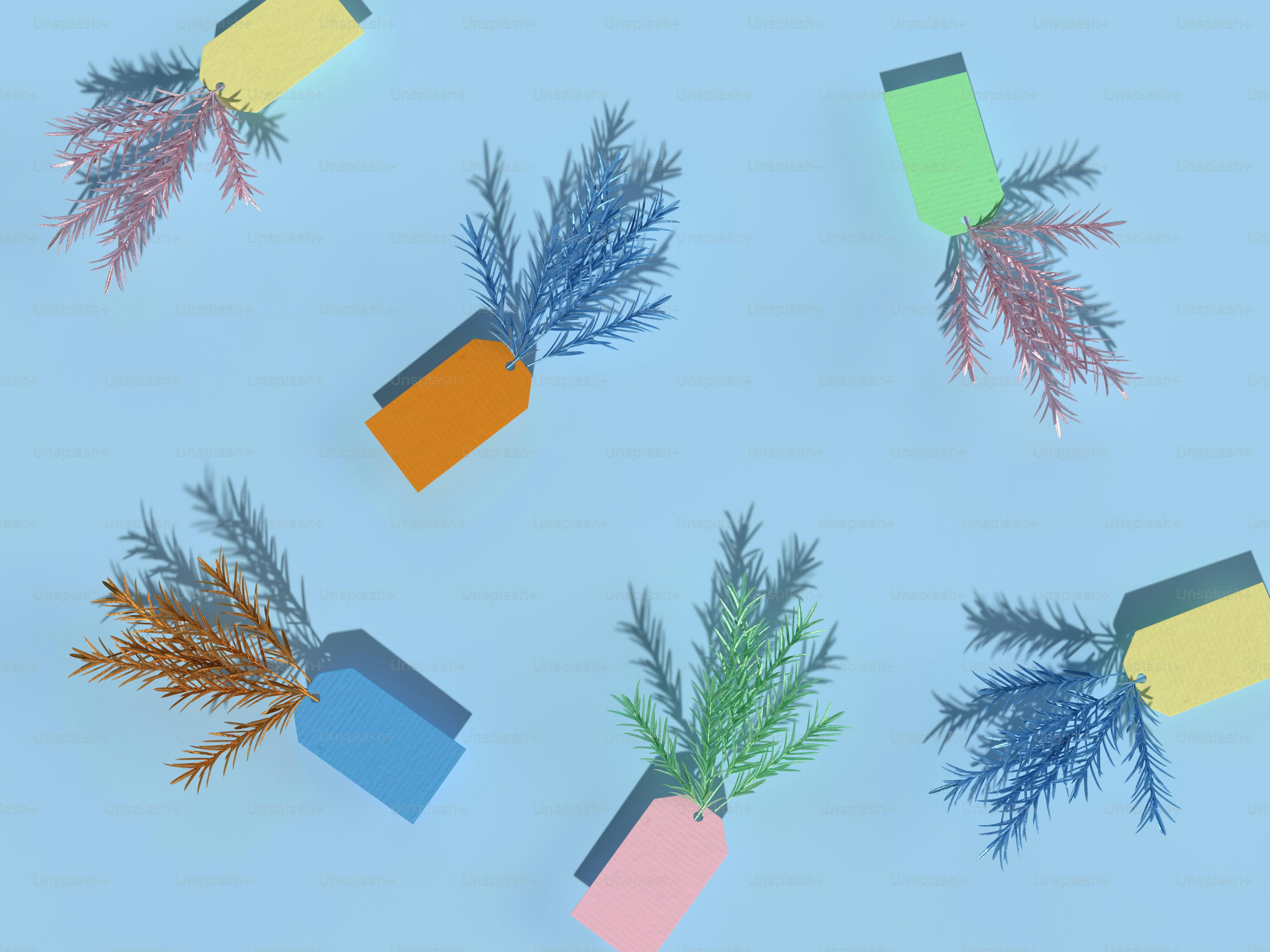 A bunch of different colored papers with plants sticking out of them ...