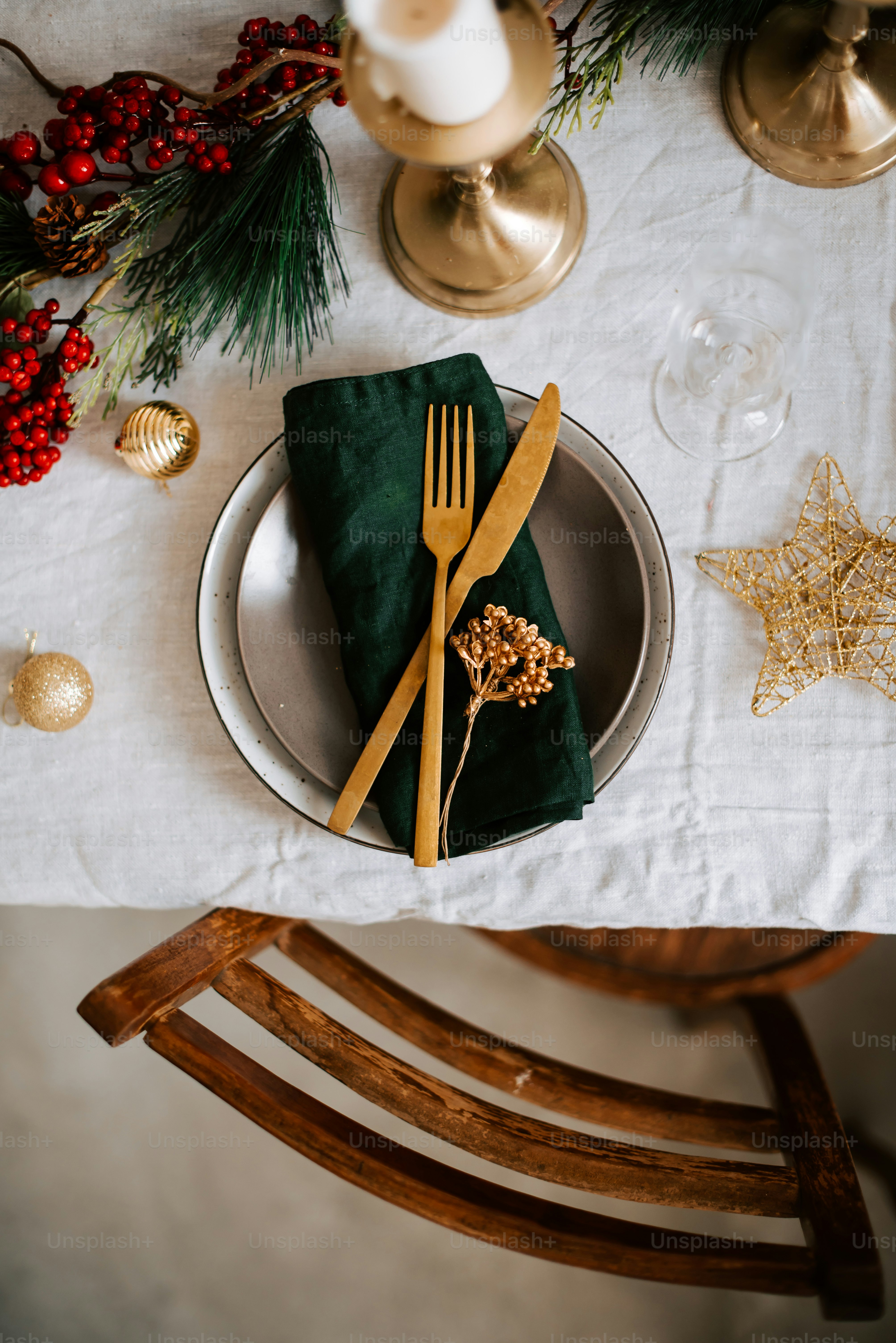A place setting with a napkin, fork and napkin holder photo – Christmas ...