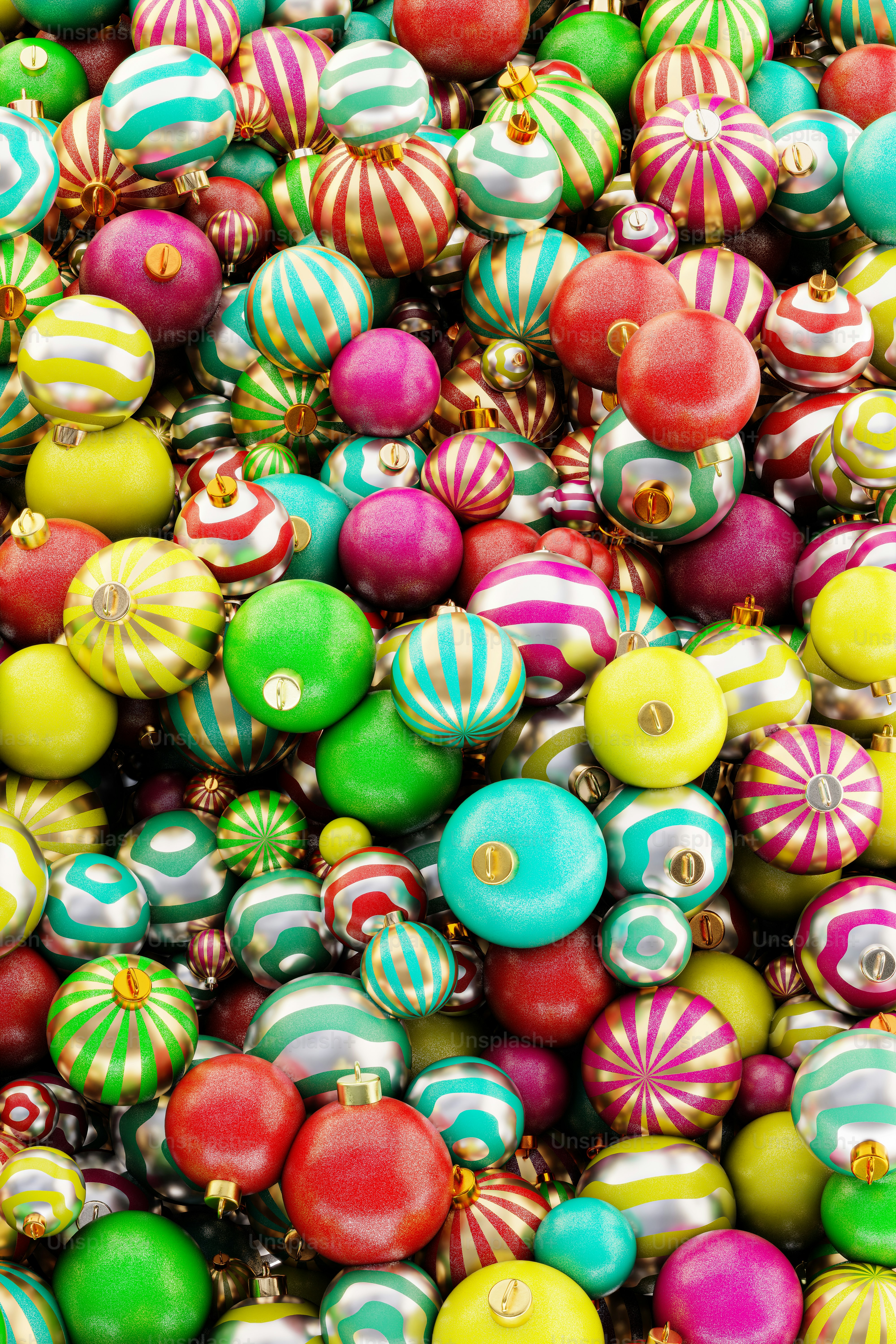A pile of colorful christmas ornaments sitting on top of each other ...