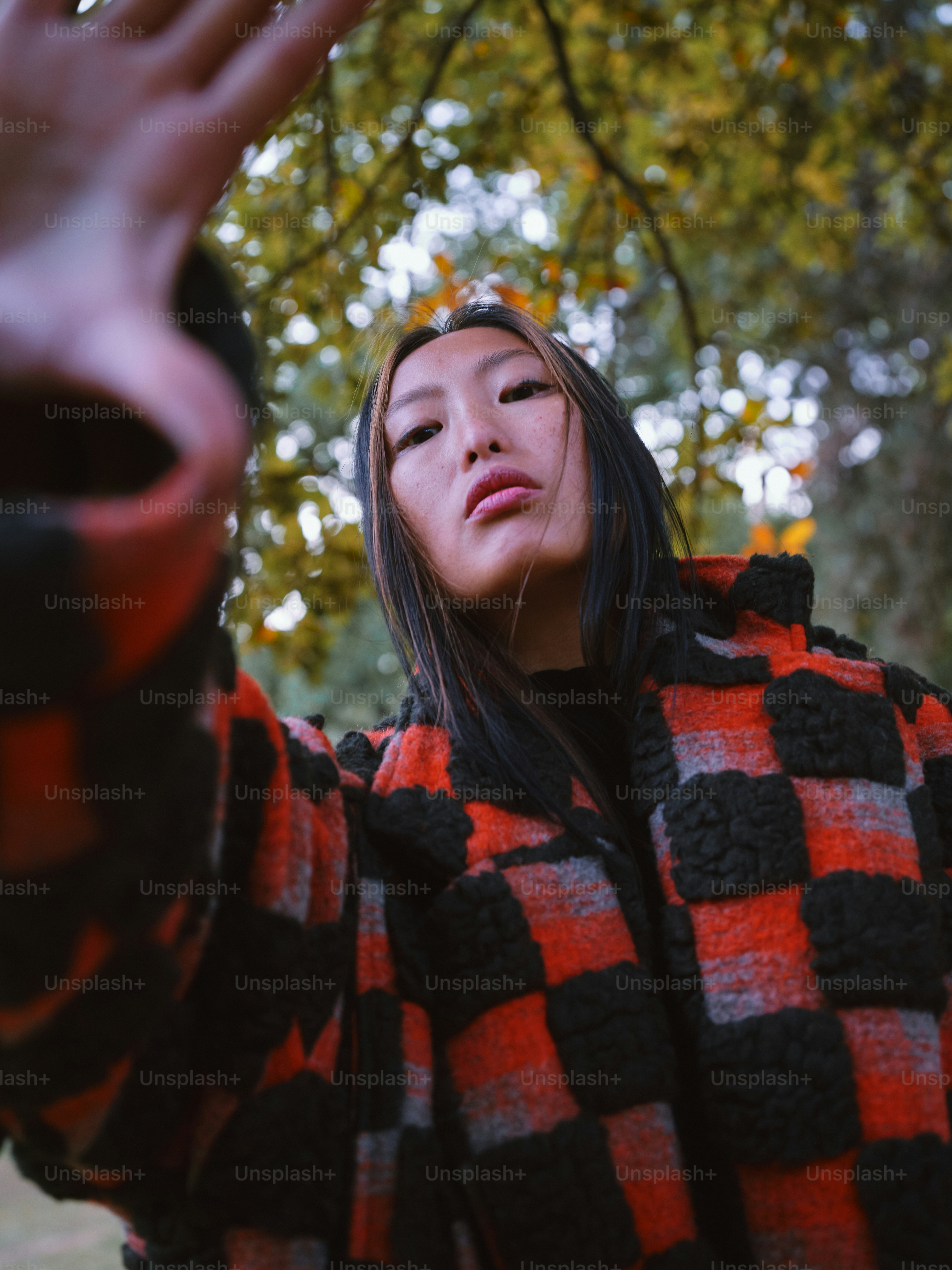 A woman in a red and black checkered coat photo – Autumn Image on Unsplash