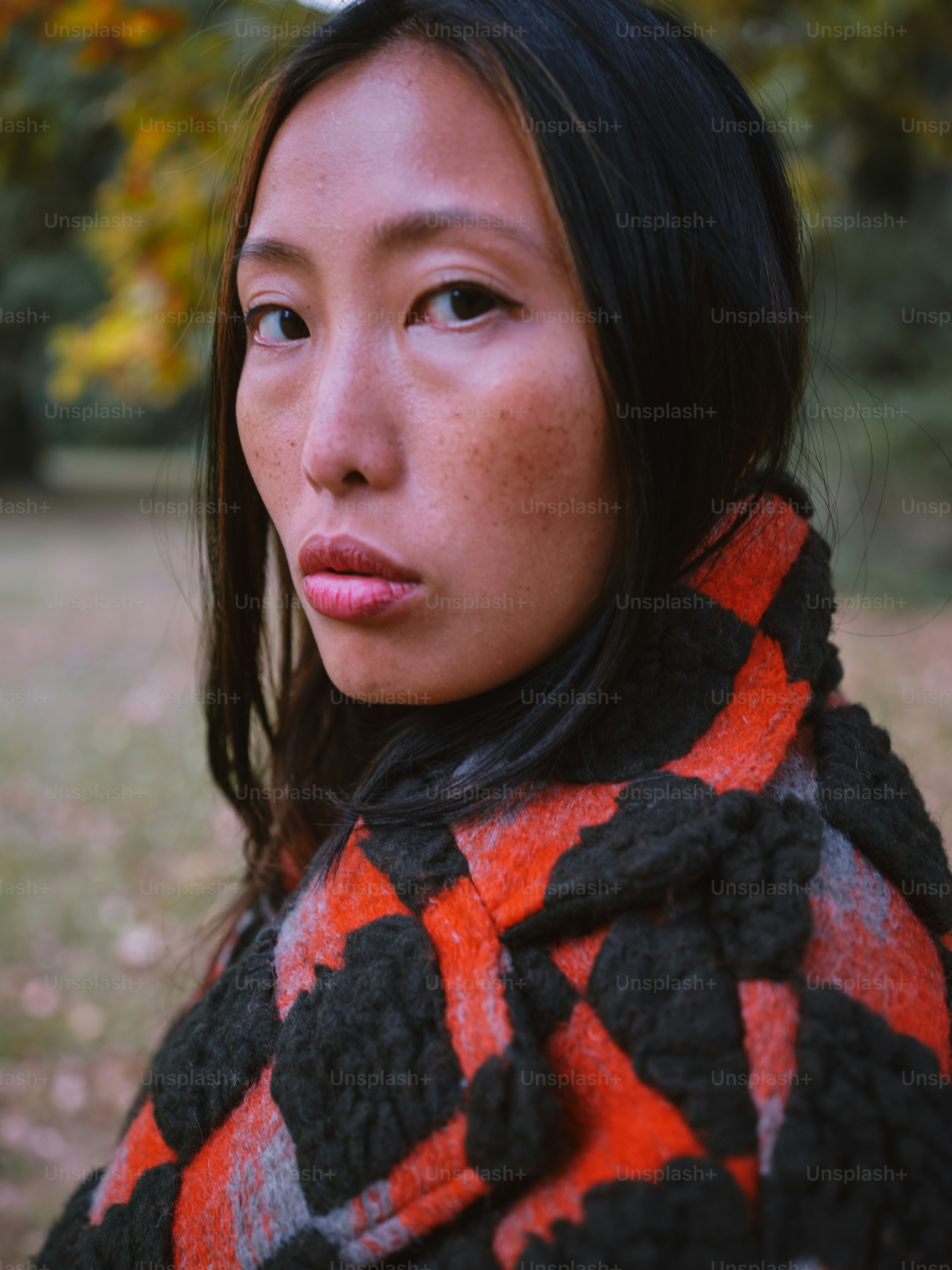 A close up of a person wearing a scarf photo – Fall fashion Image on ...