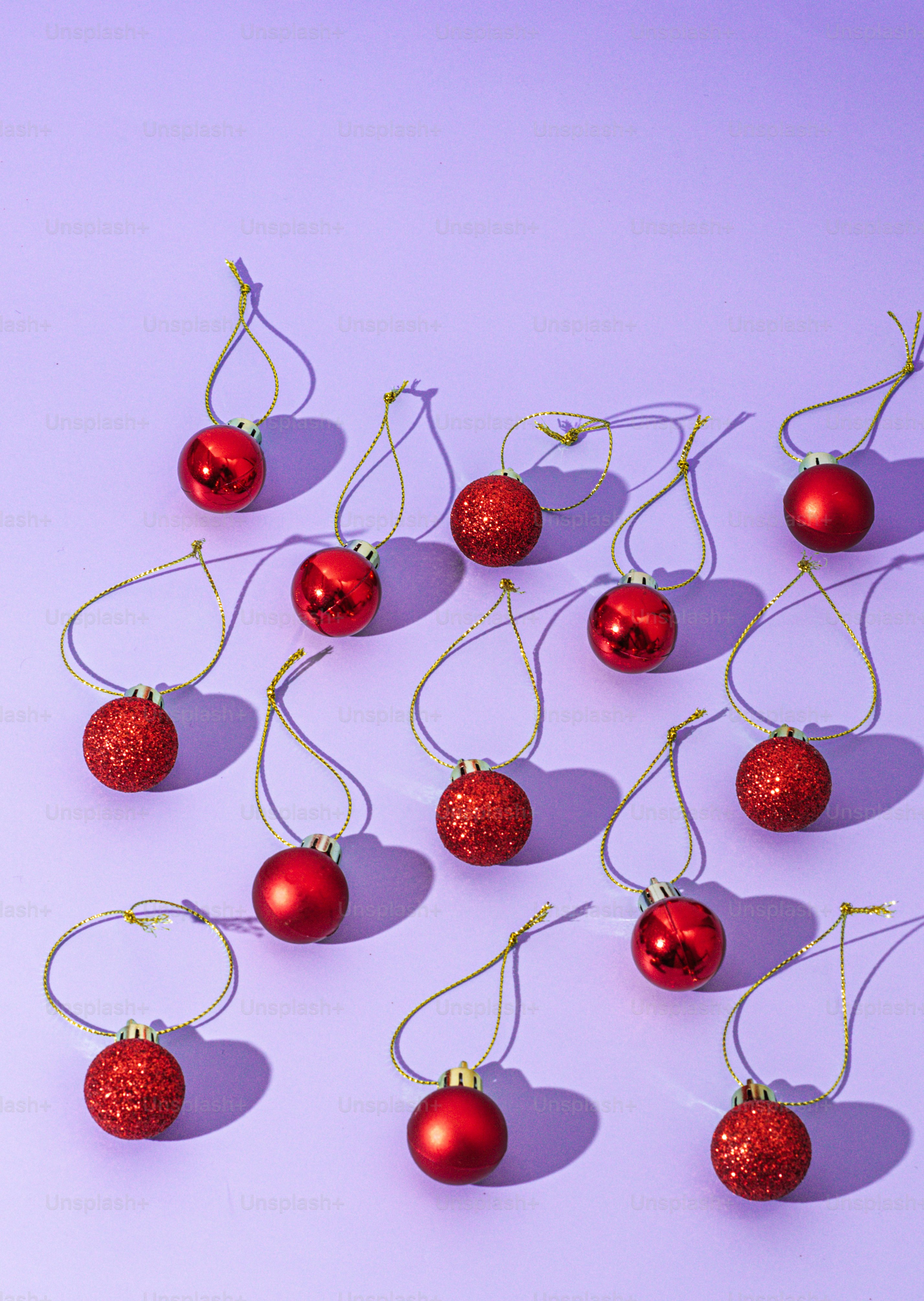 A bunch of red ornaments hanging from a string photo – Christmas ...