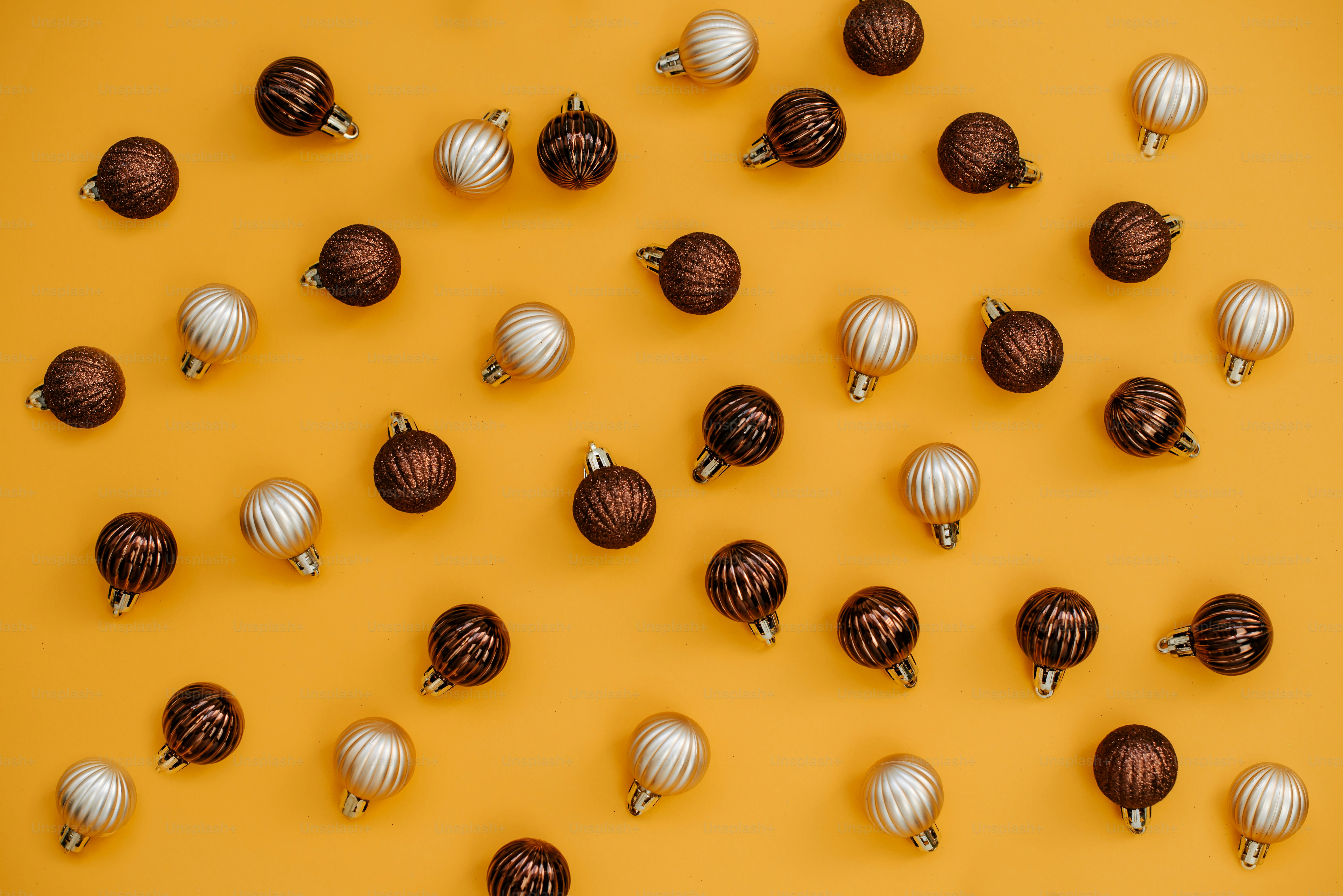 A group of chocolate candies on a yellow background photo – Christmas ...
