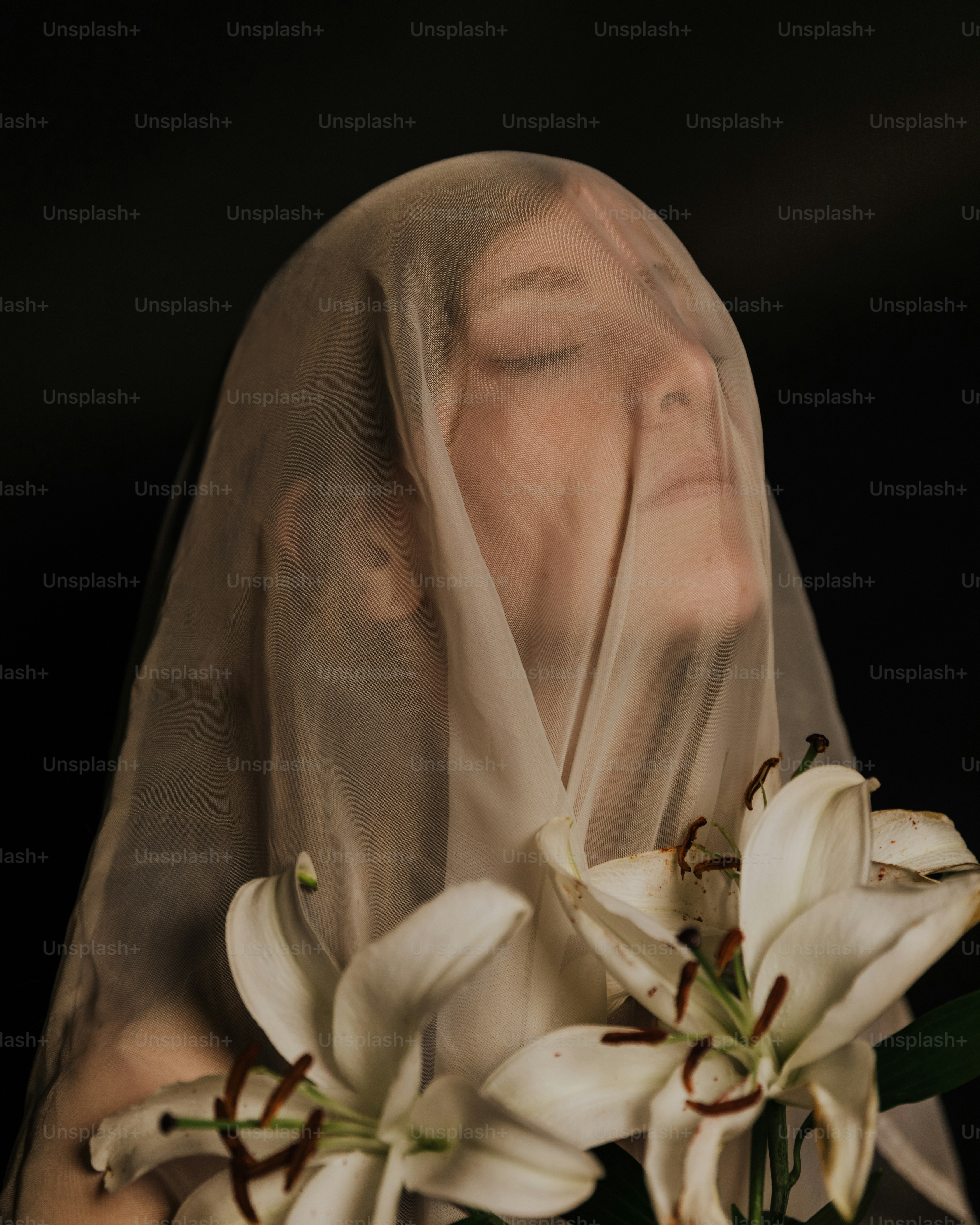 A woman wearing a veil covering her face photo – Blue monday Image on ...