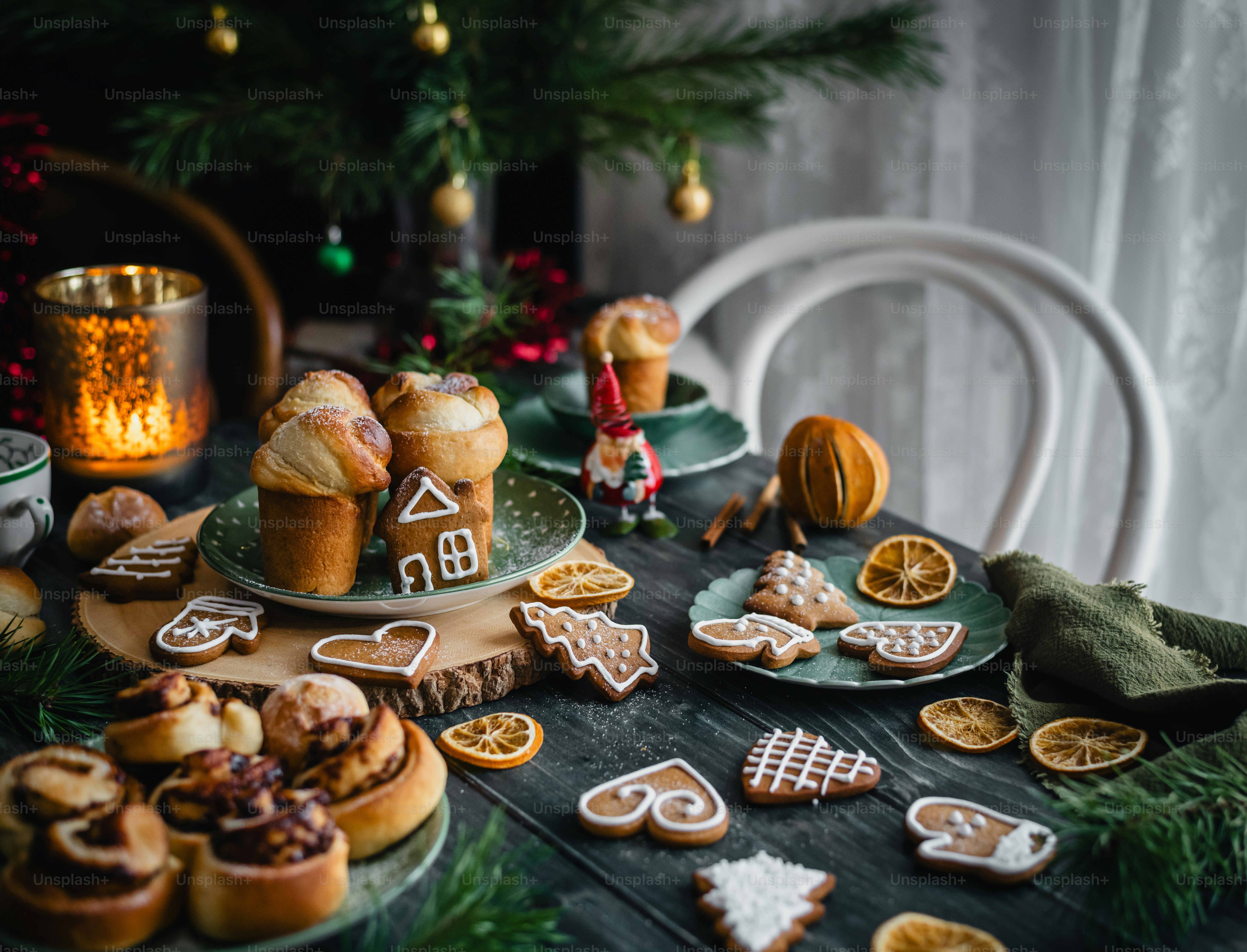A table topped with lots of pastries and cookies photo – Christmas ...