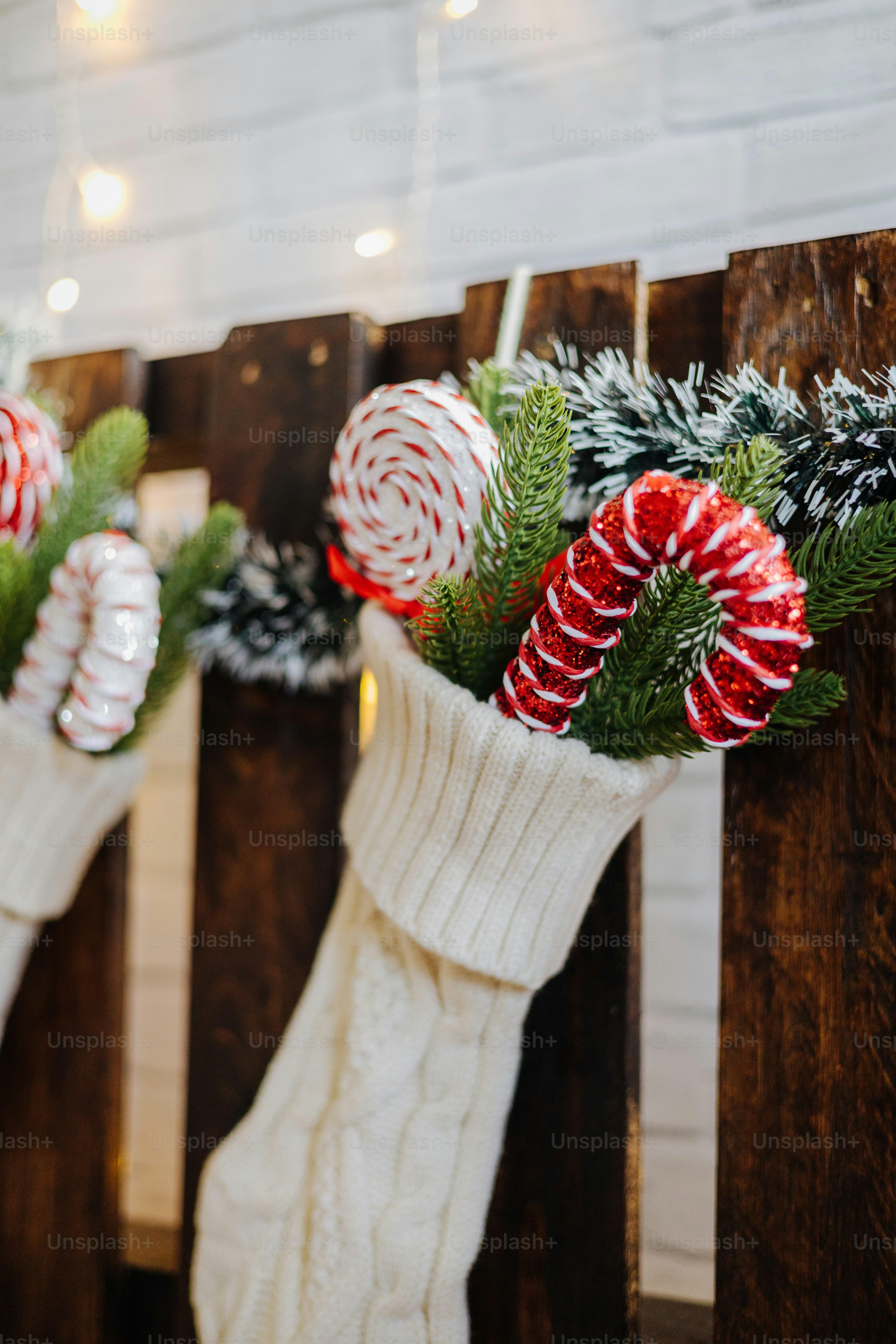 Stockings with candy canes hanging from them photo – Christmas ...