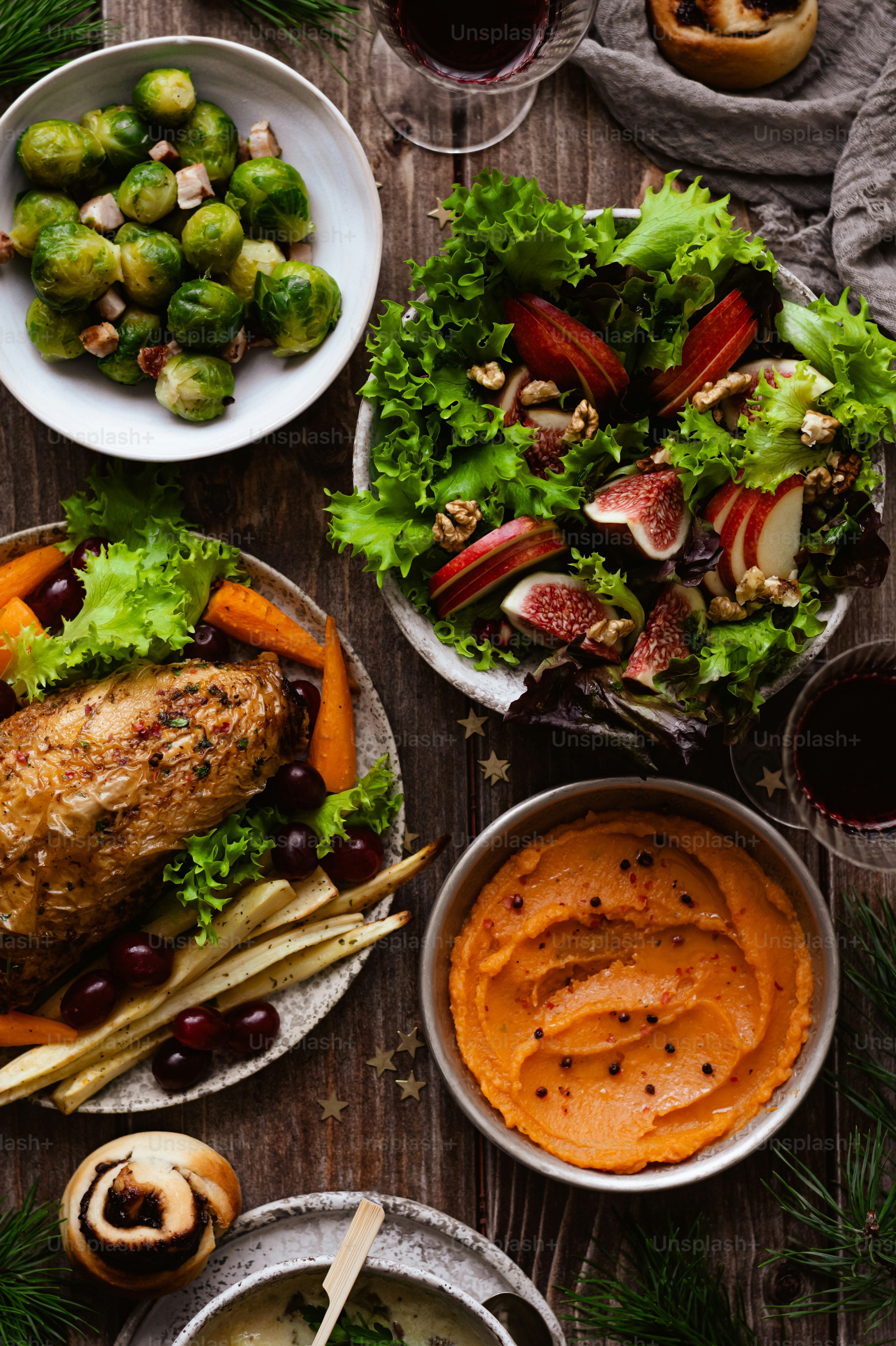 A wooden table topped with bowls of food photo – Roast dinner Image on ...