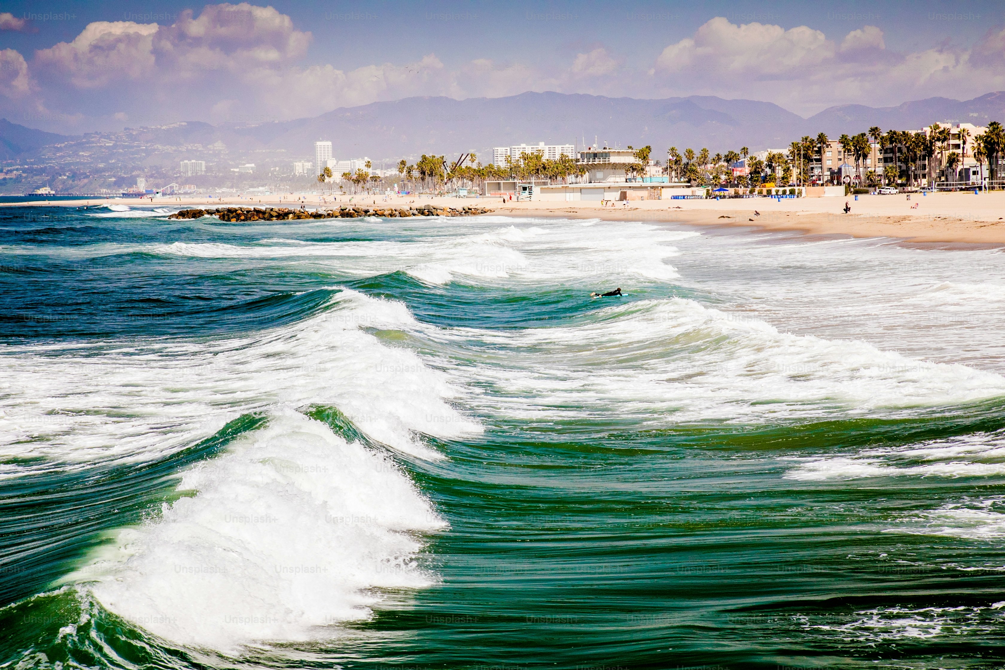 A beautiful shot of the Venice Beach with waves in California photo ...