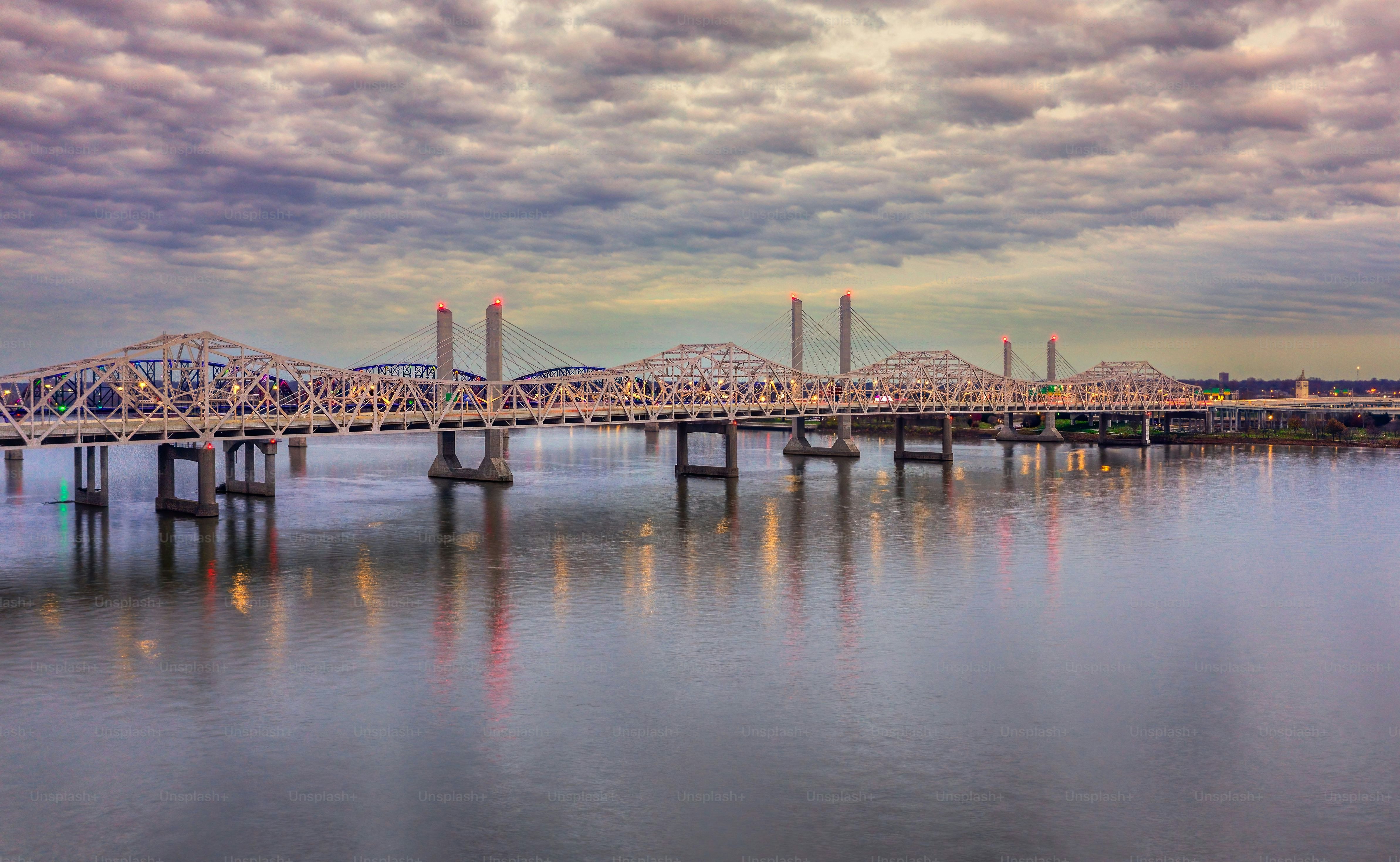 An aerial view of bridge over Ohio river in Louisville during sunset ...