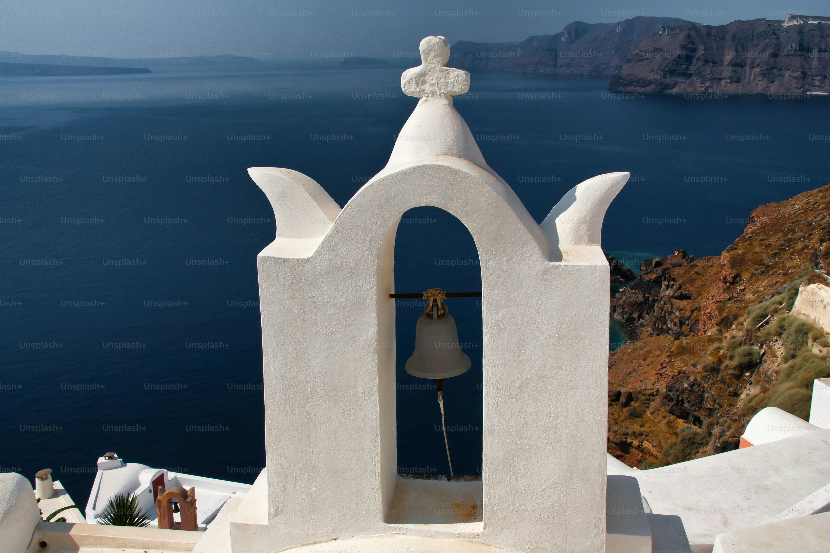 A traditional church bell in Oia on the Greek island of Santorini ...