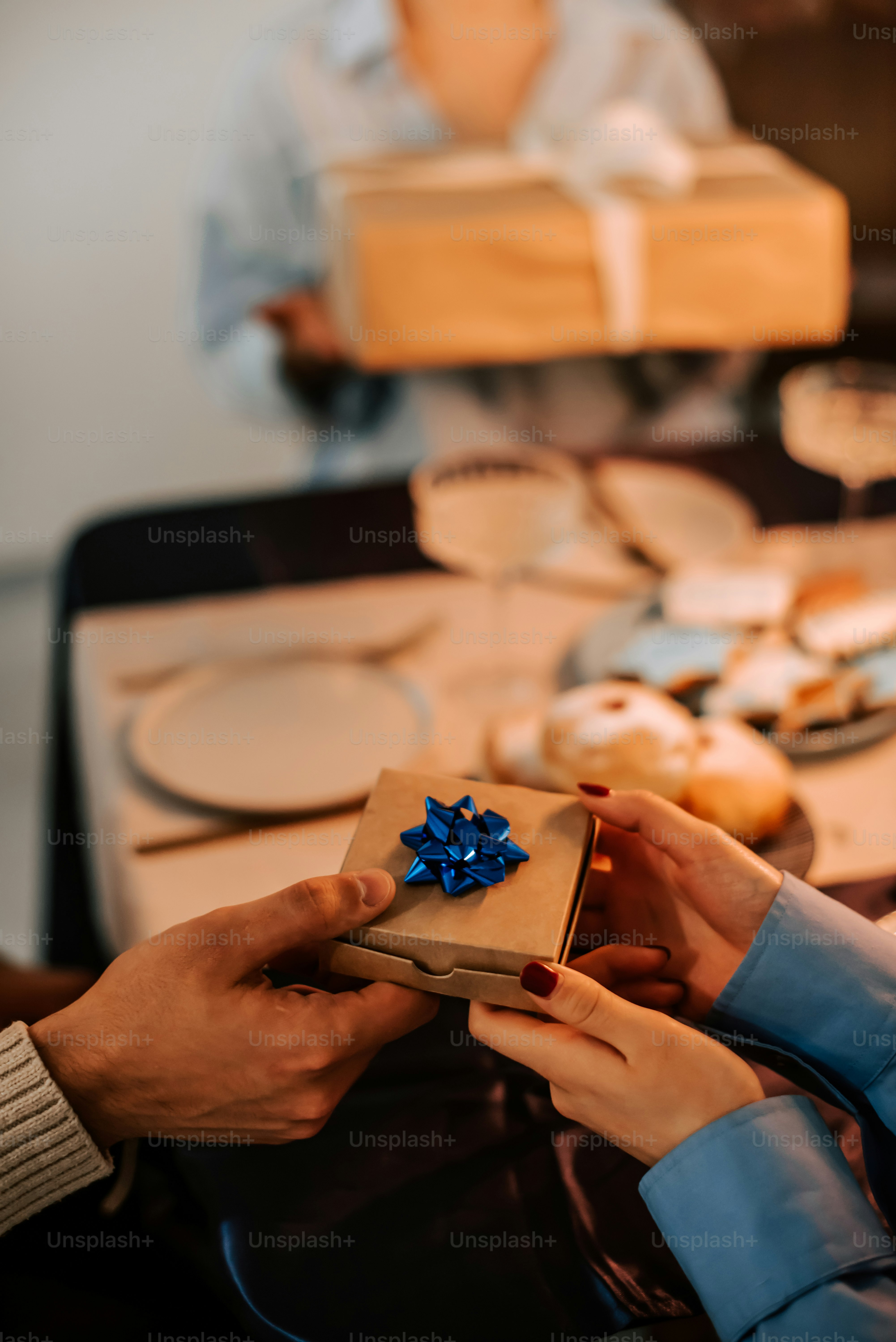 A person handing a box of cookies to another person photo – Hanukkah ...