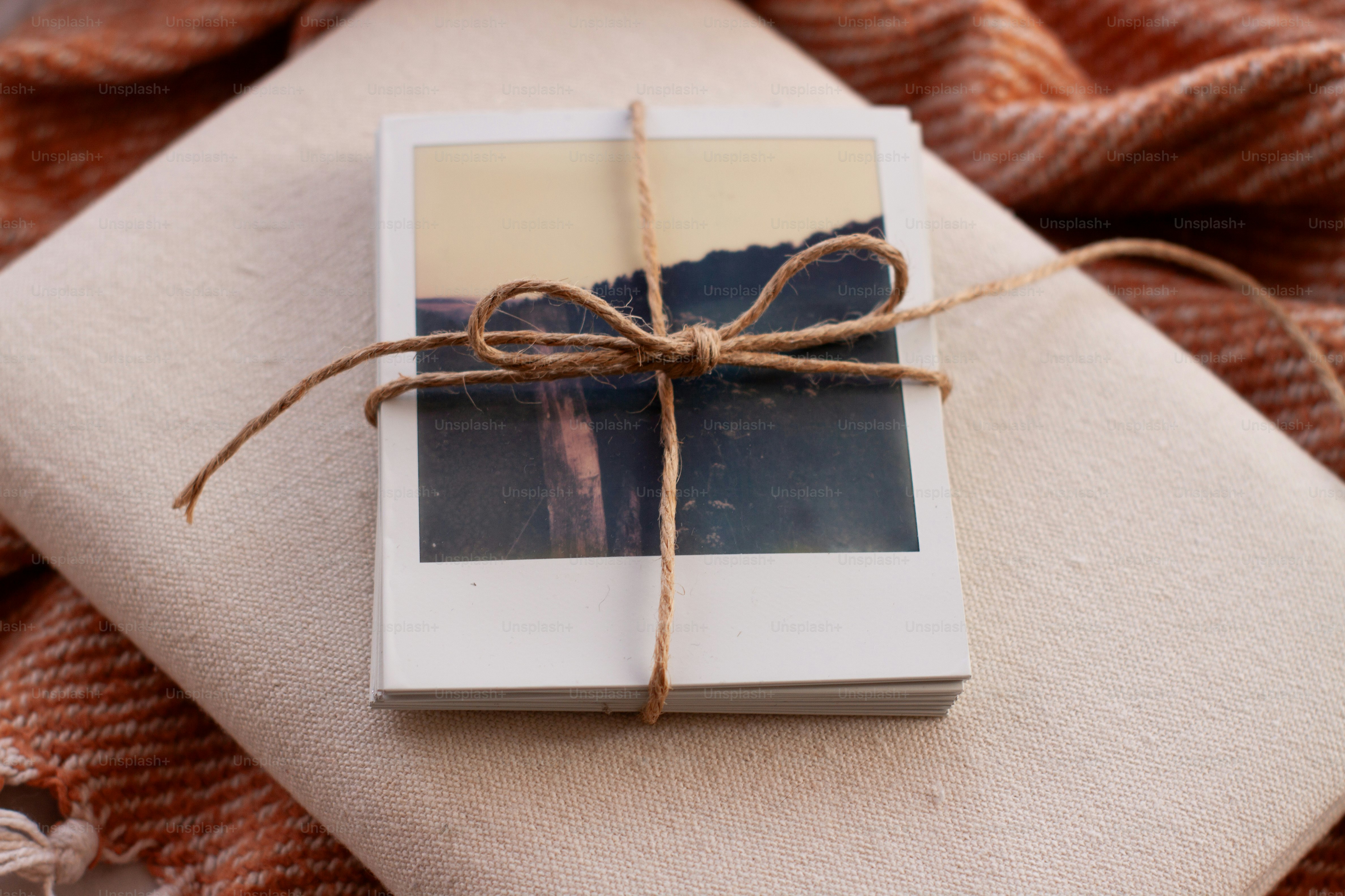 A book wrapped in twine and tied with a string photo – Polaroid Image ...