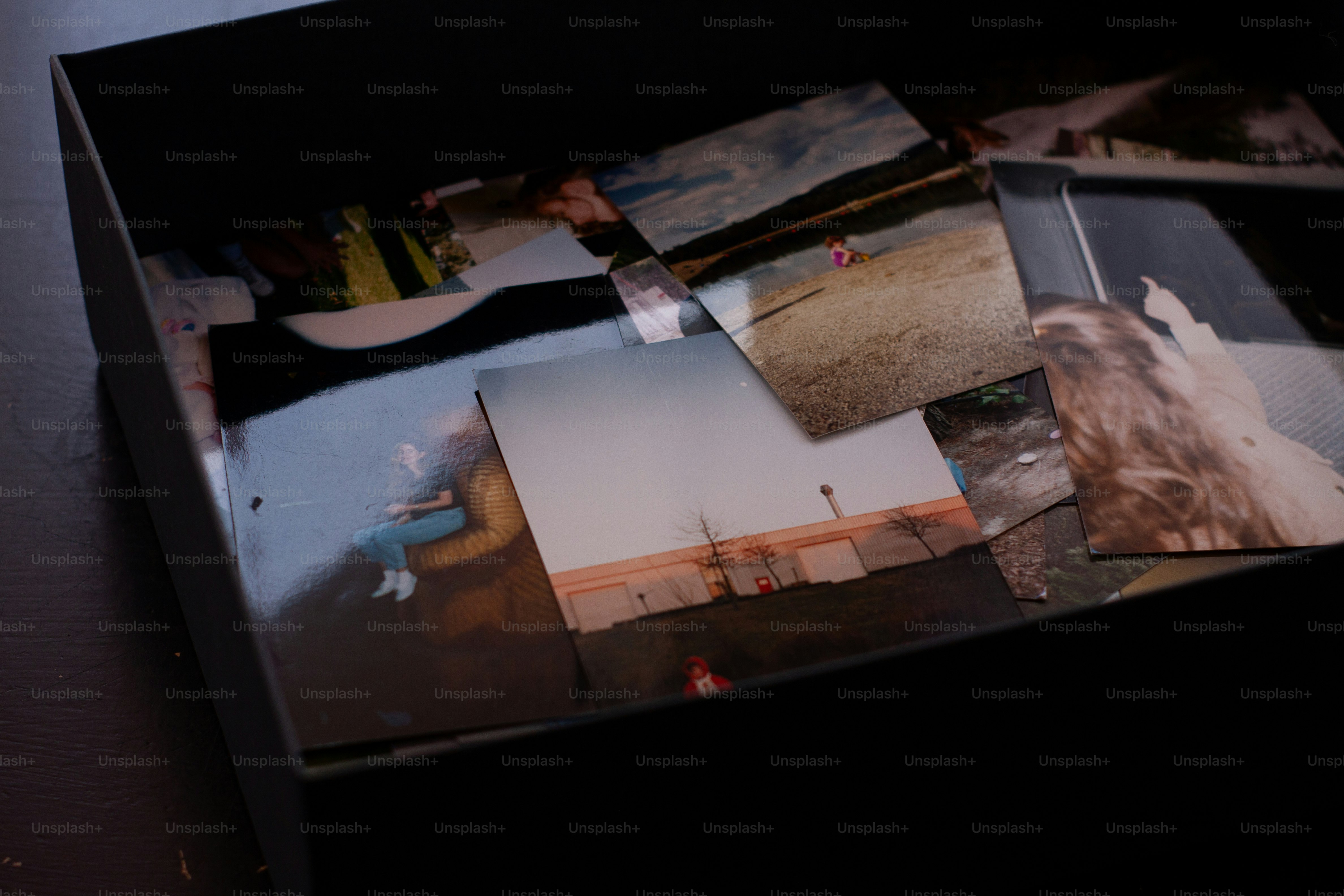 A black box filled with pictures of people photo – Analog Image on Unsplash