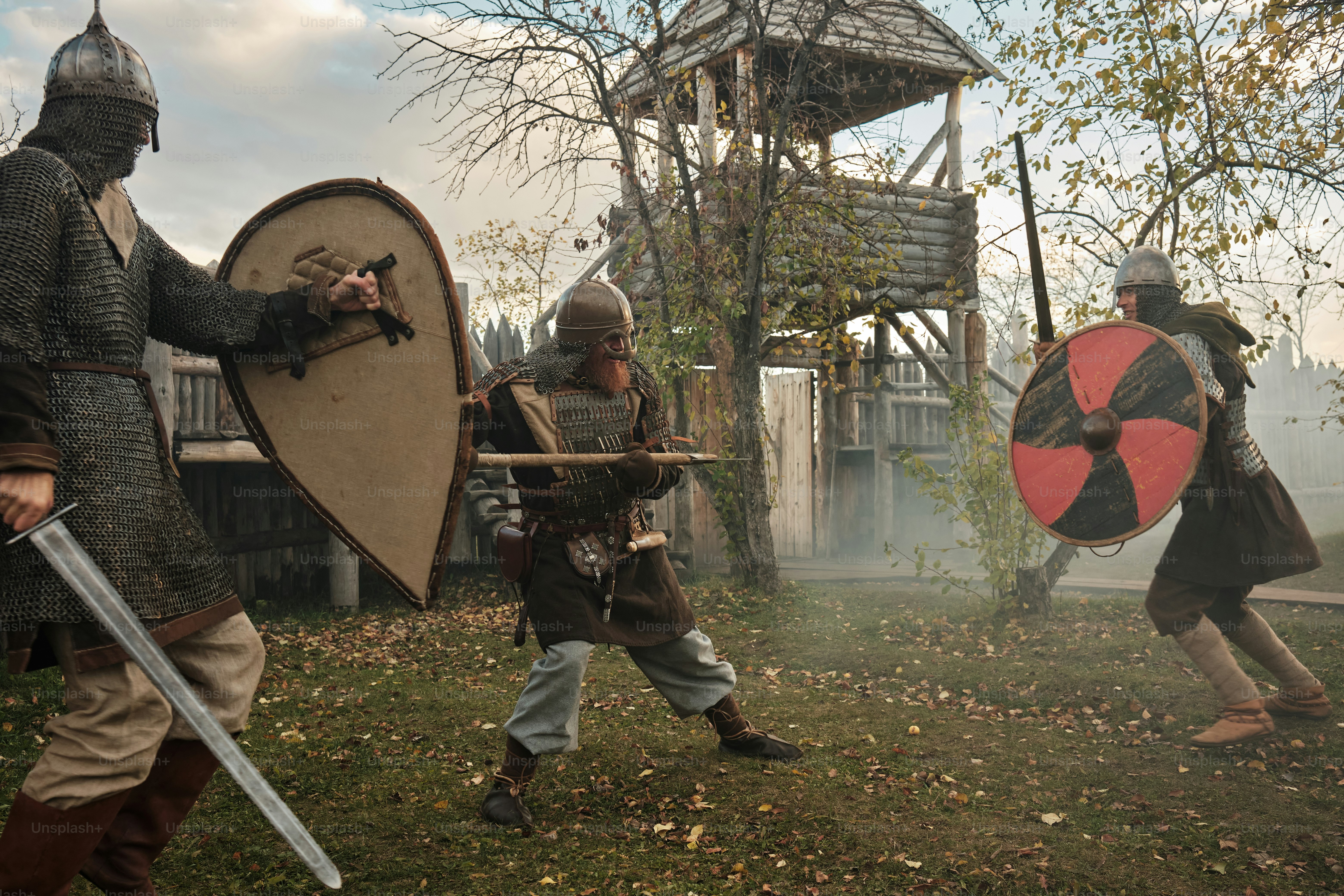 A group of men dressed in medieval costumes photo – Knight Image on ...