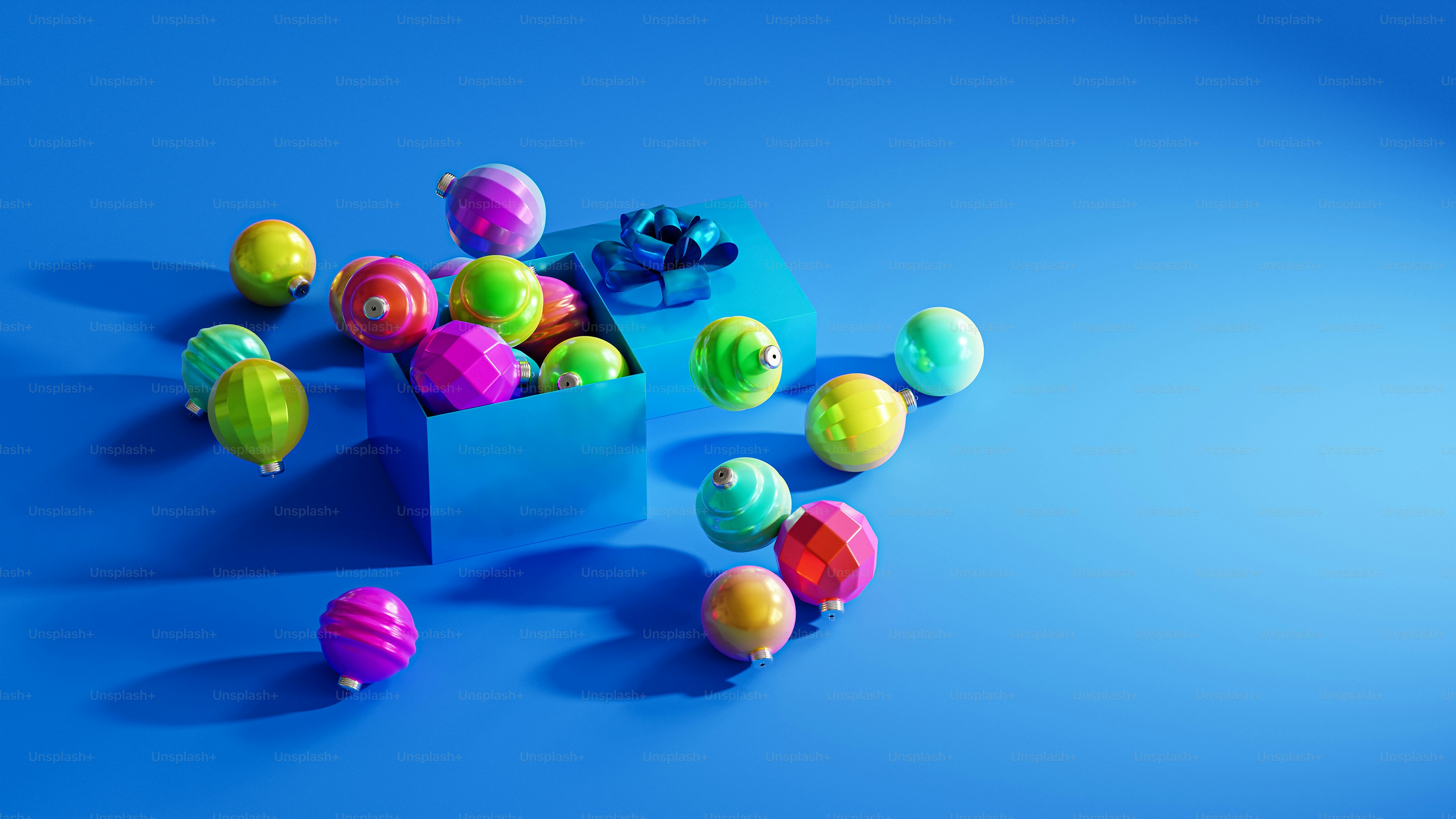A blue box filled with lots of colorful balls photo – Background Image ...