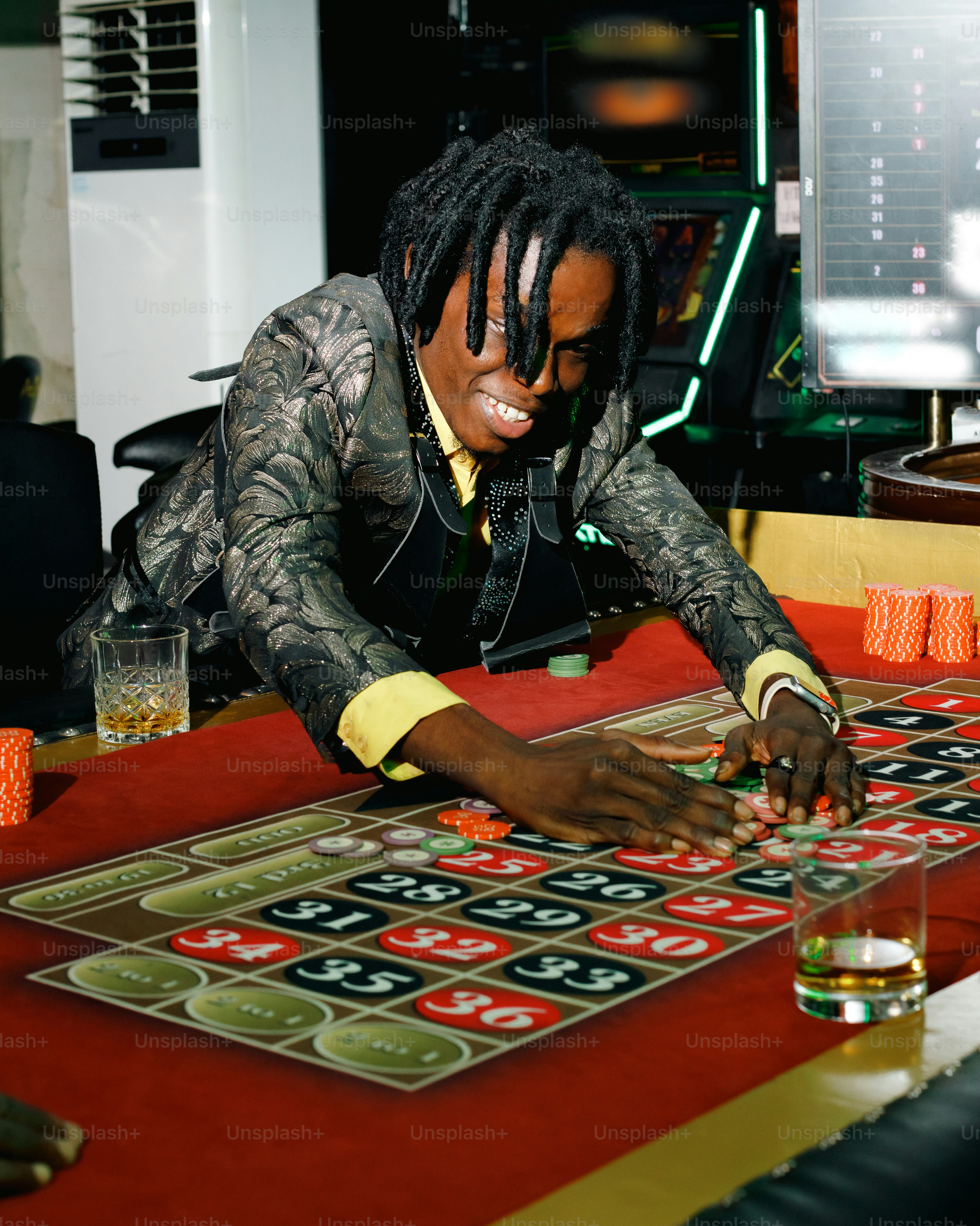 A group of people playing a board game photo – Gambling Image on Unsplash