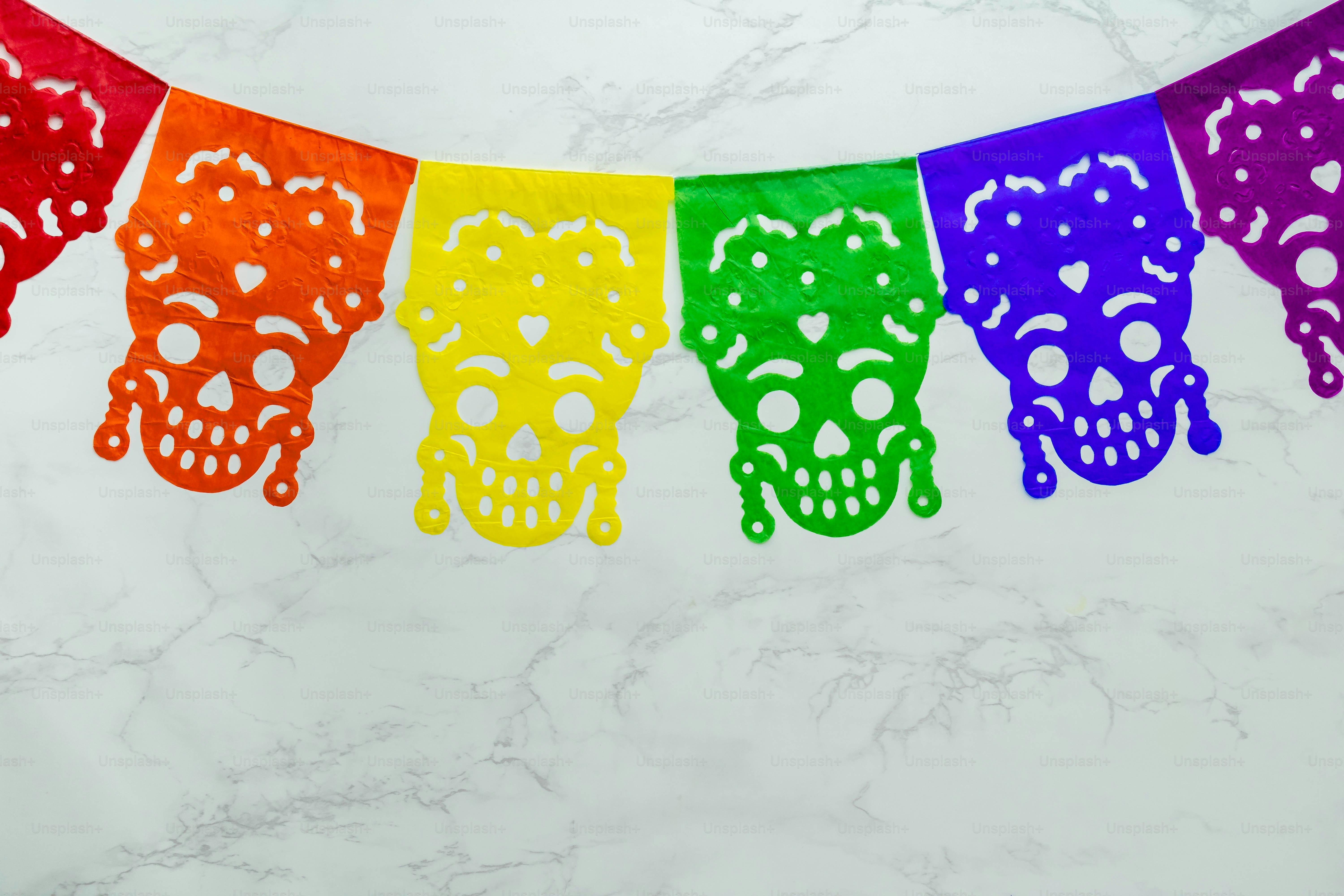 A colorful day of the dead banner on a marble wall photo – Calaveras ...